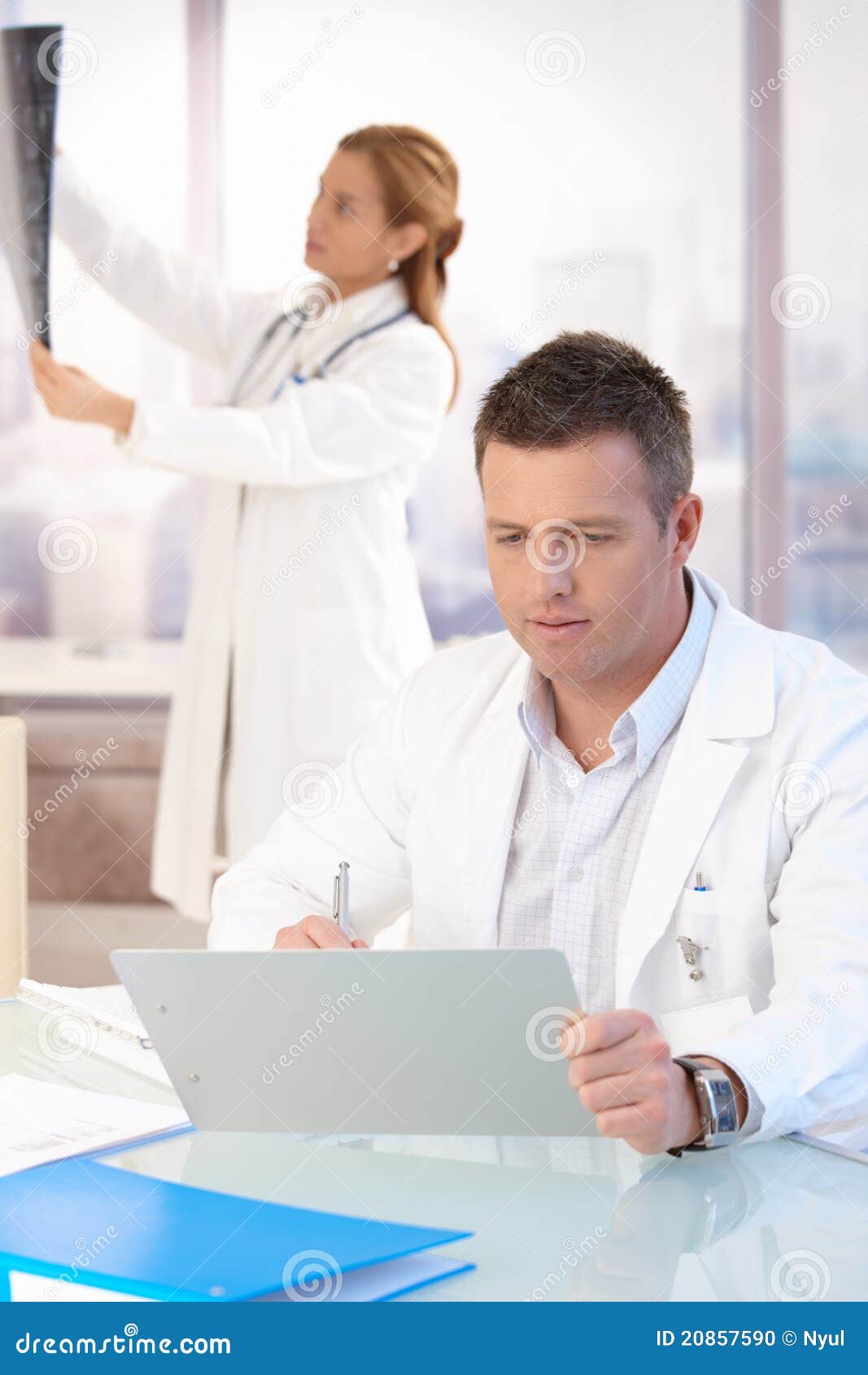 Handsome Guy Doctor In White Lab Coat With Stethoscope On White ...