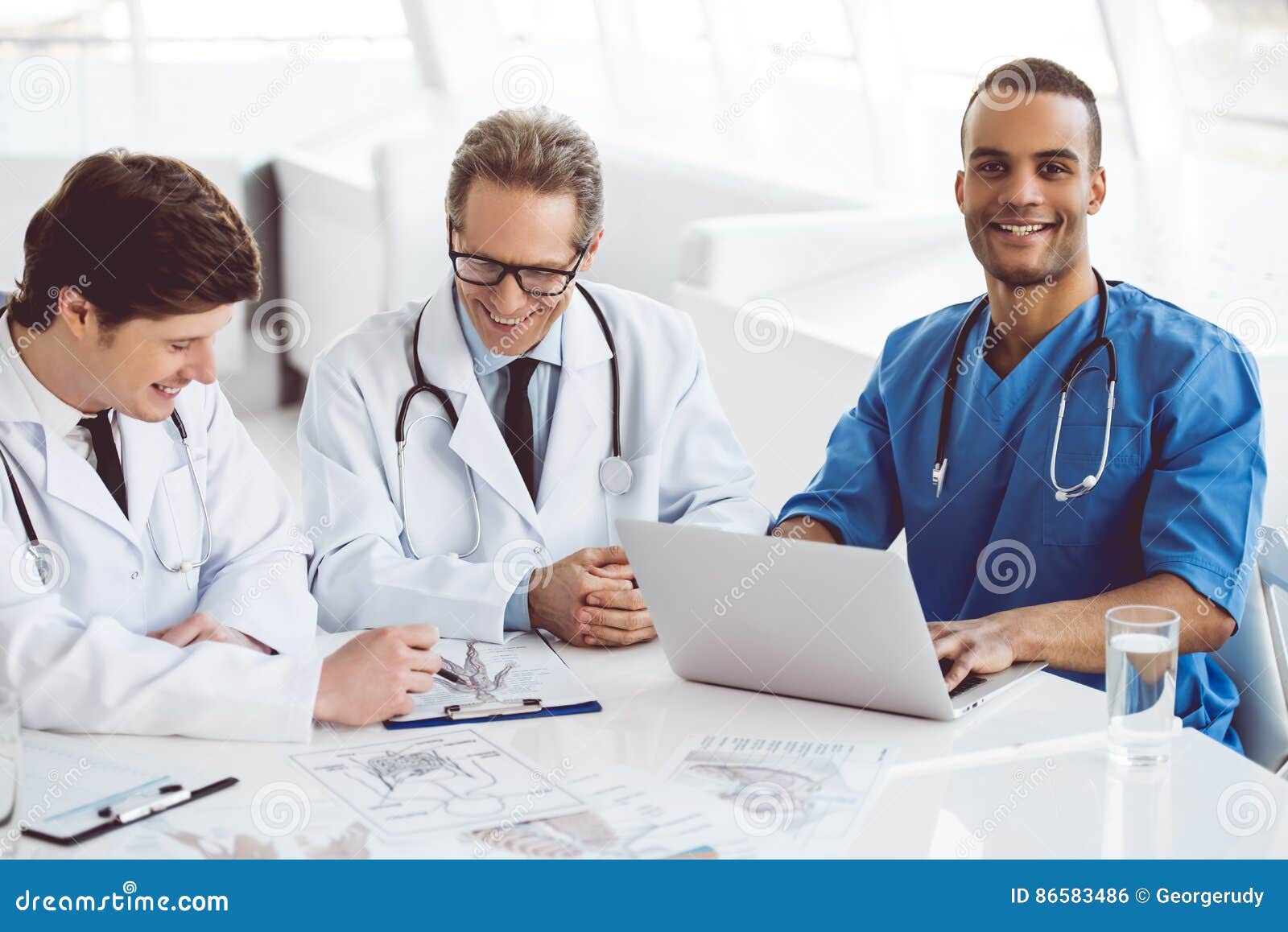 Handsome doctors working stock photo. Image of health - 86583486