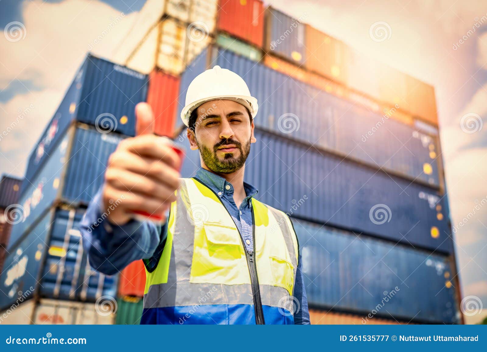 Handsome Engineer or Foreman Wears PPE Checking Container Storage with ...