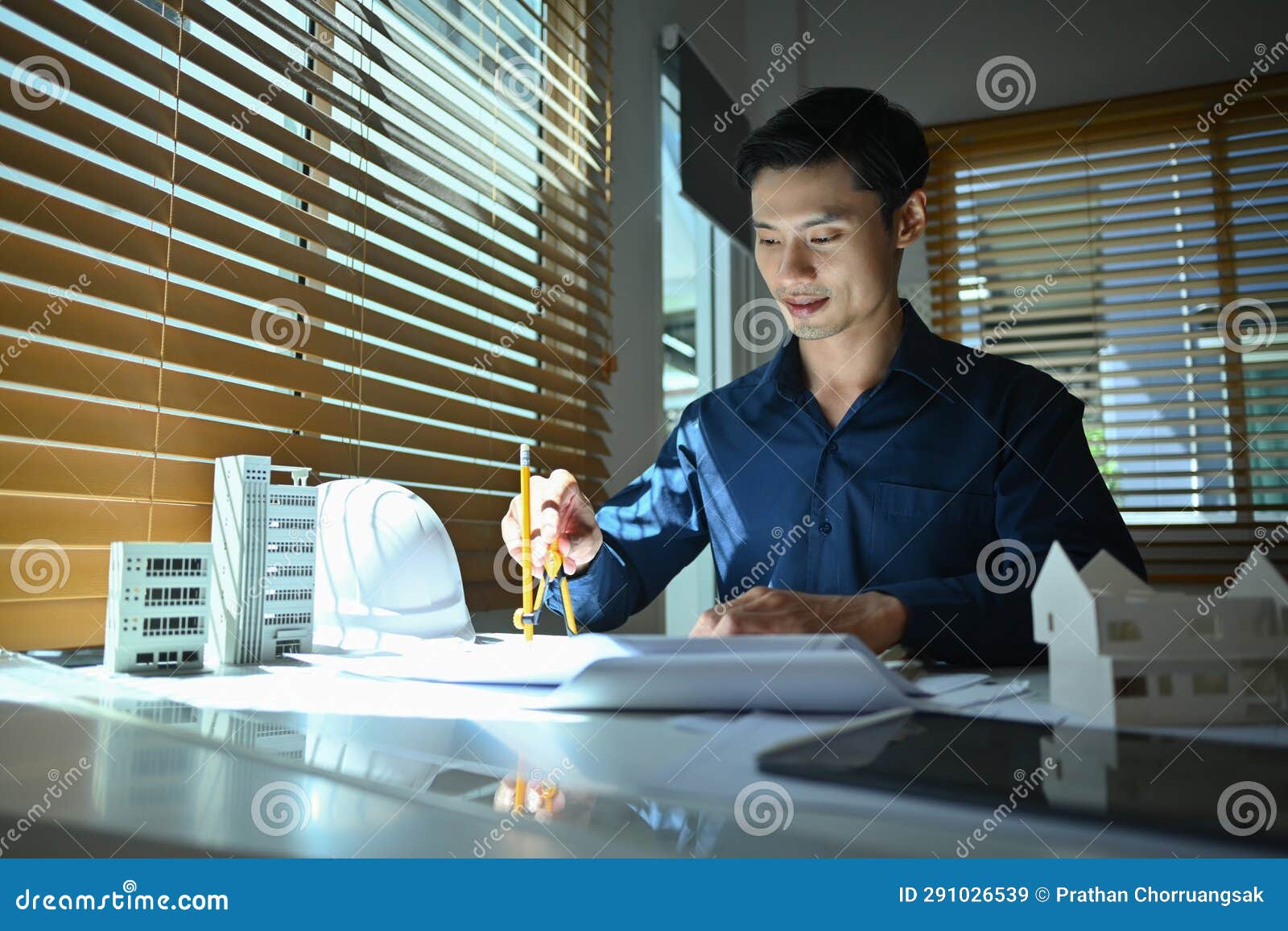 Handsome Engineer Man Using Compass, Working on Project of Residential in Bright Office Stock ...