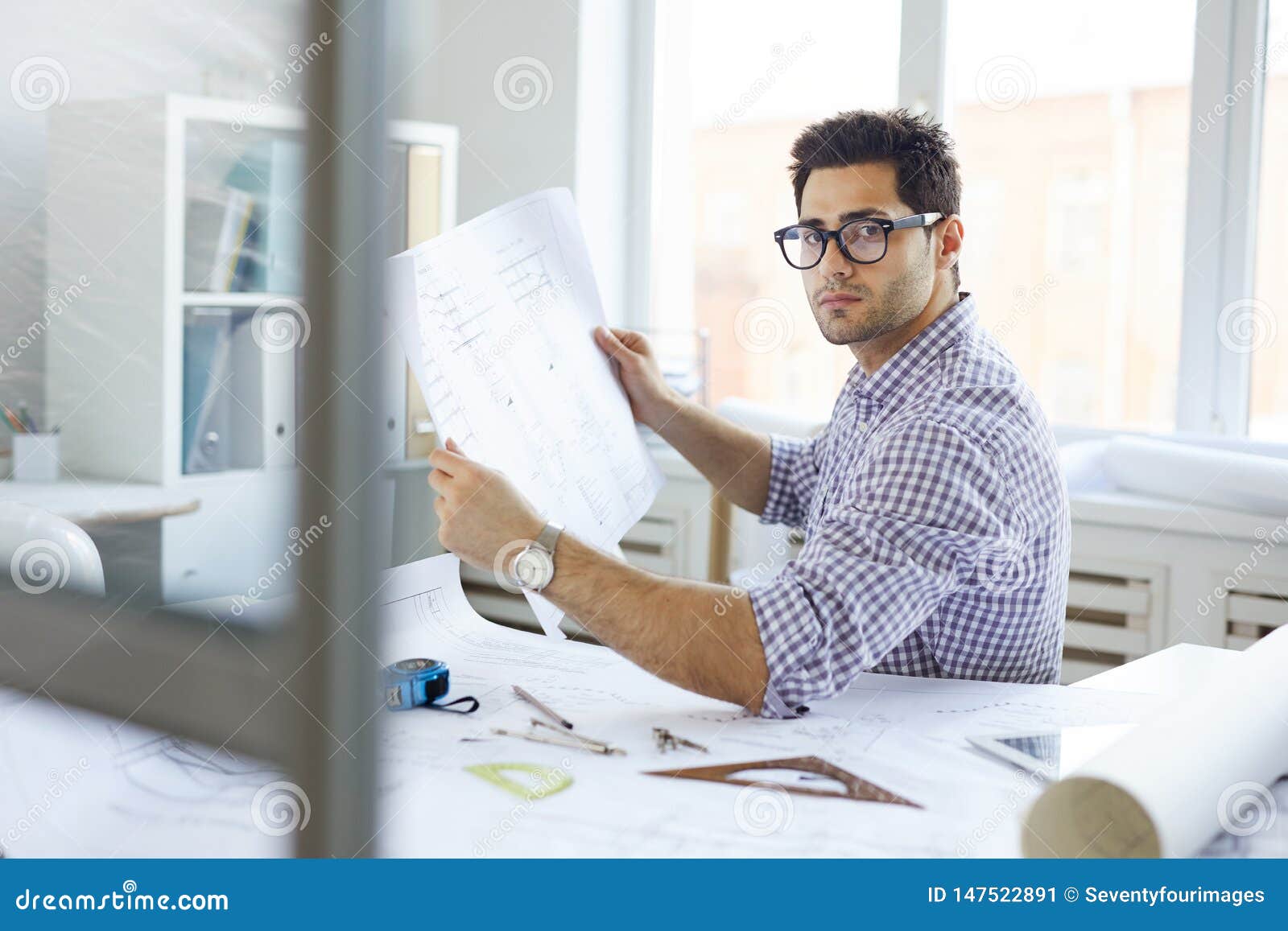 Handsome Engineer at Workplace Stock Image - Image of plans, occupation ...