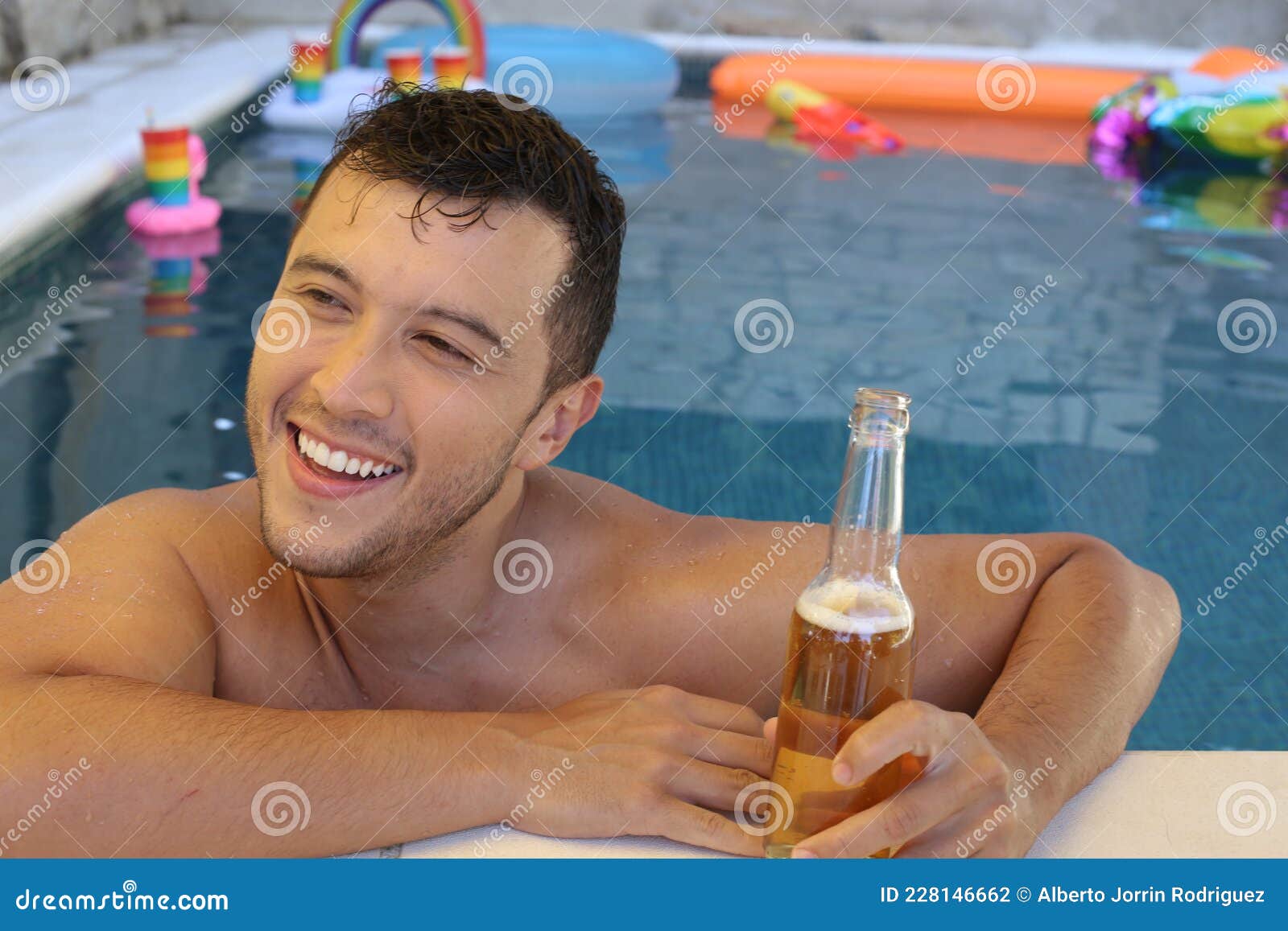 Handsome Ethnic Young Man Drinking Beer in Swimming Pool Stock Photo ...