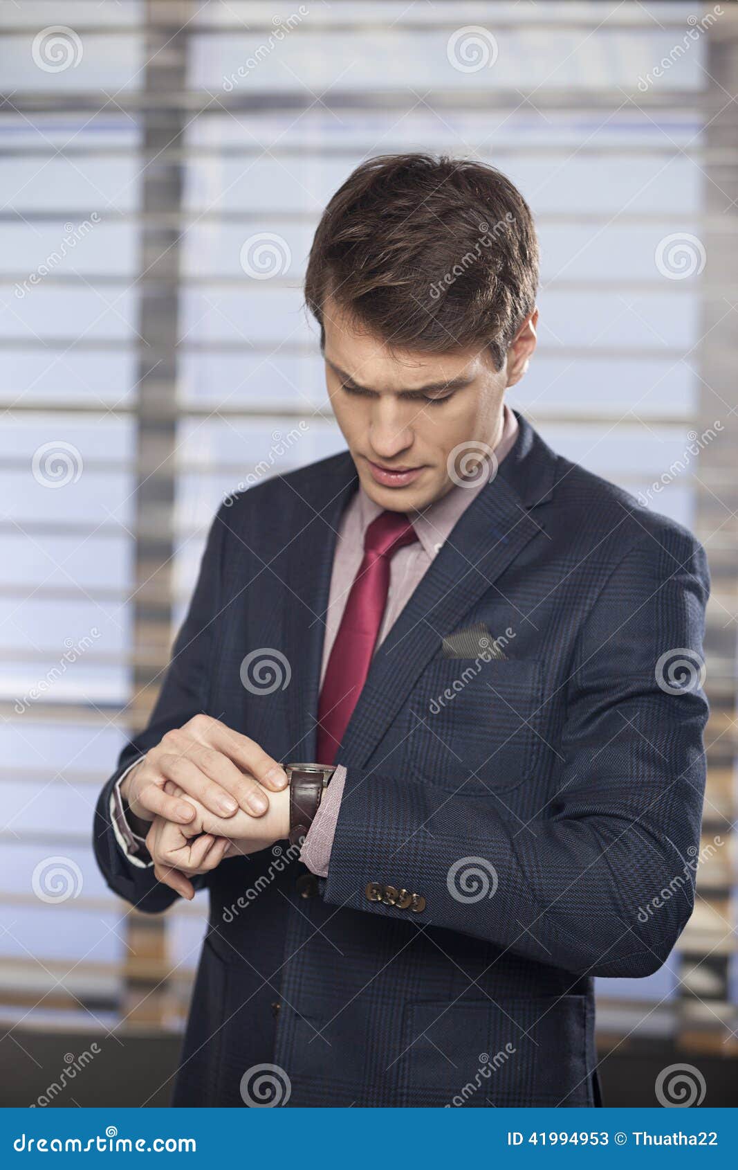 Handsome Executive Checking the Time on His Wrist Watch Stock Image ...