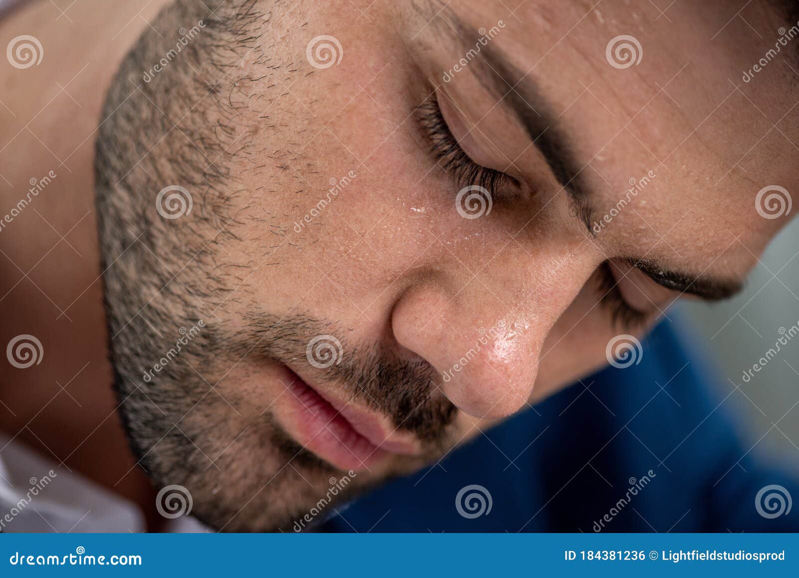 Exhausted Man with Sweaty Face Suffering from Heat on Grey Stock Photo ...