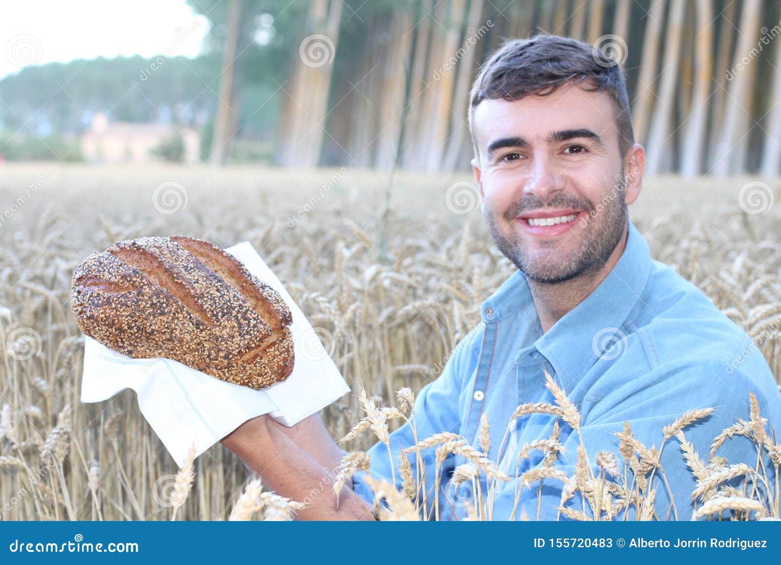 Handsome Farmer Holding Bread in Wheat Field Stock Image - Image of ...