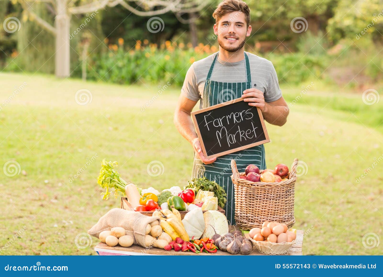 Handsome Farmer Standing at His Stall and Holding Chalkboard Stock ...