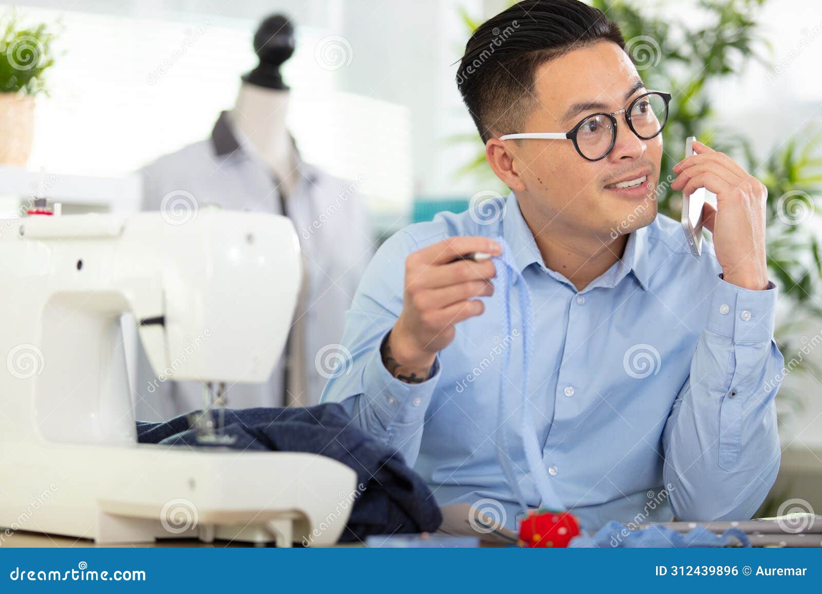 Handsome Fashion Designer Sewing with Sewing Machine Stock Photo ...