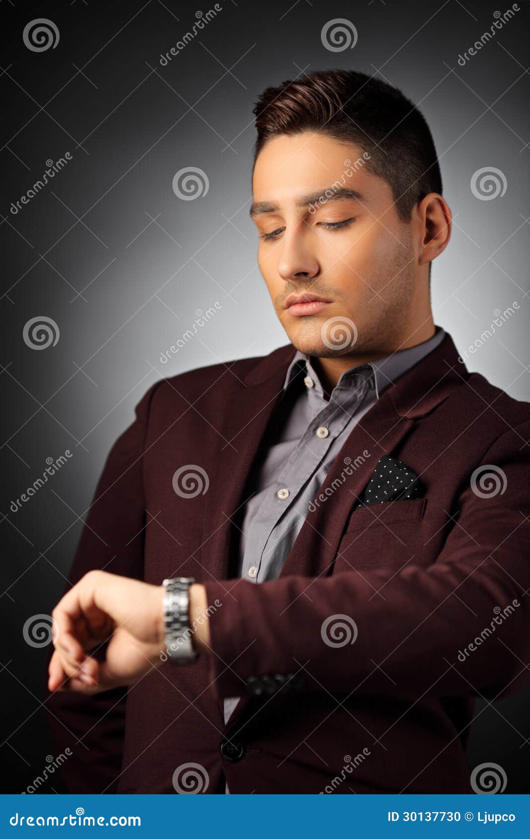 Handsome Fashionable Guy Checking the Time on His Watch Stock Photo ...