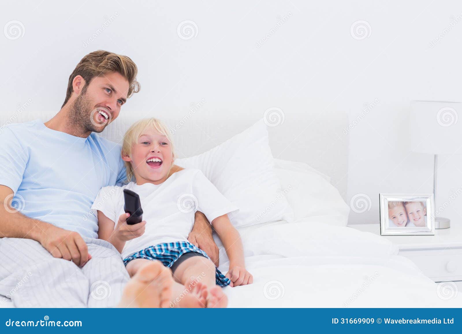 Handsome Father and Son Watching TV Together Stock Image - Image of ...