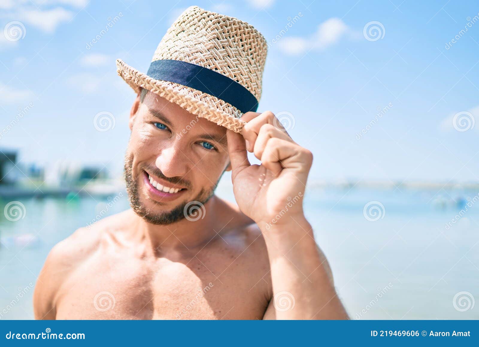 Handsome Fitness Caucasian Man At The Beach On A Sunny Day Wearing