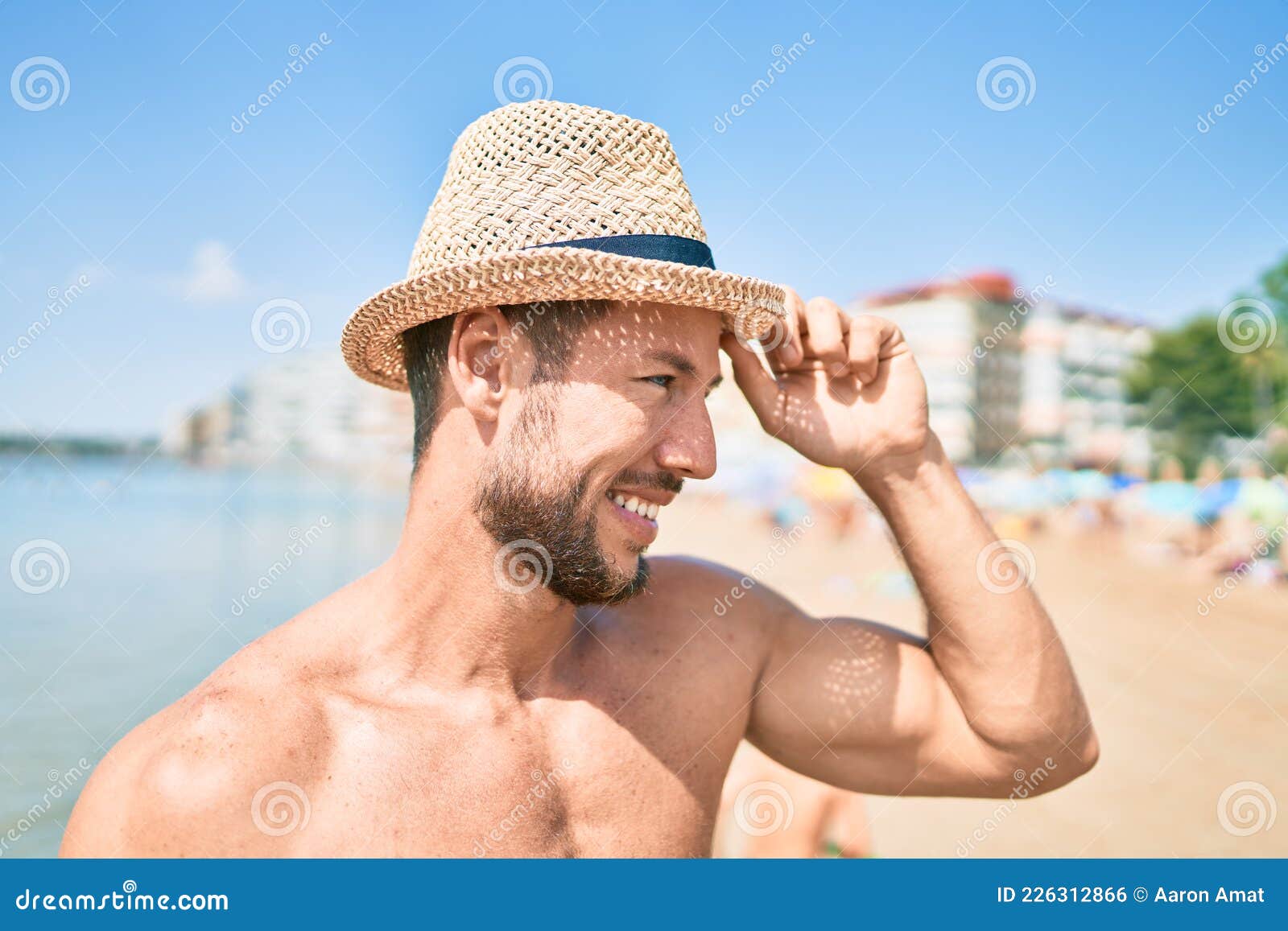 Handsome Fitness Caucasian Man At The Beach On A Sunny Day Wearing