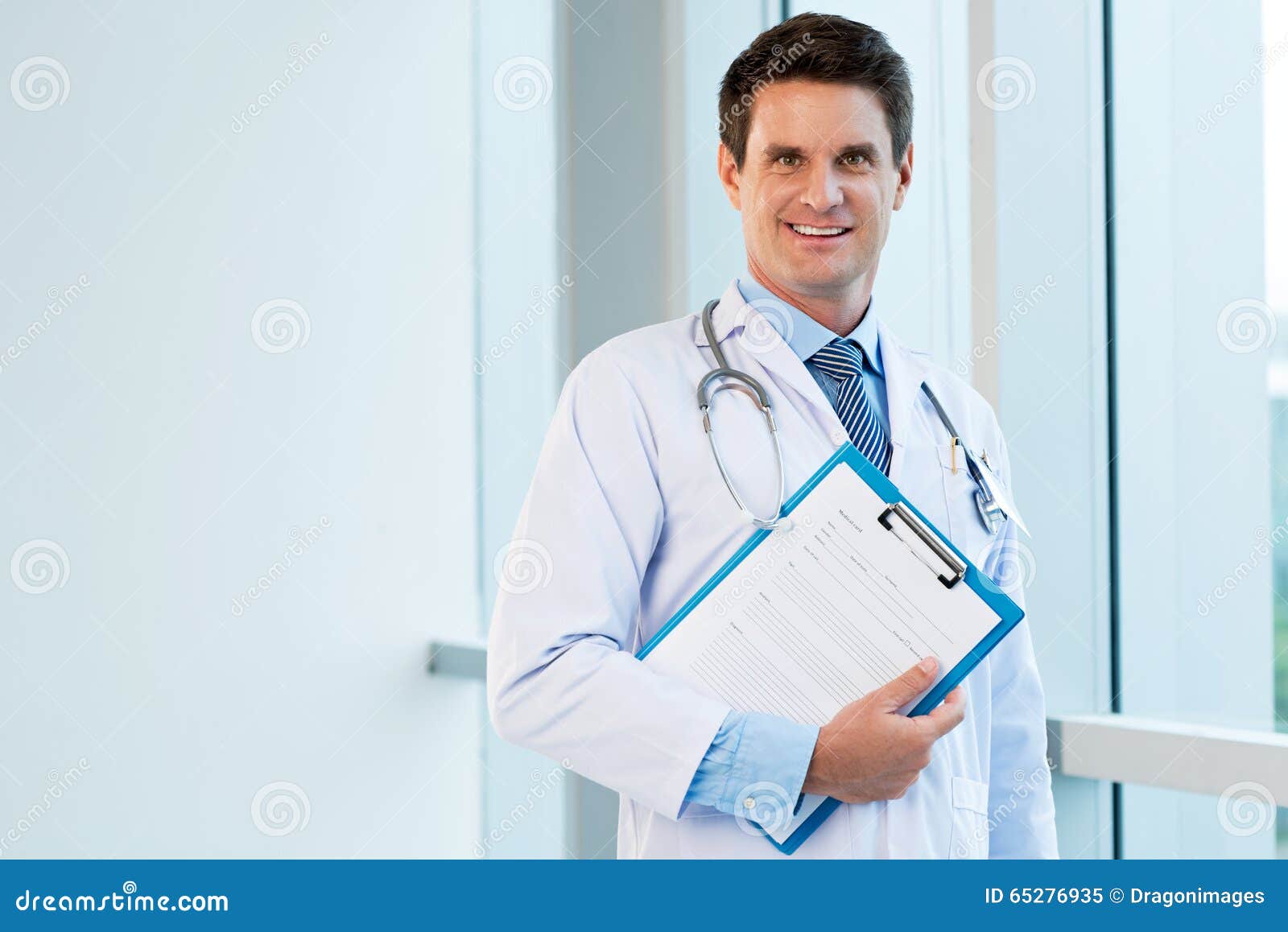 Handsome General Practitioner Stock Image - Image of reading ...