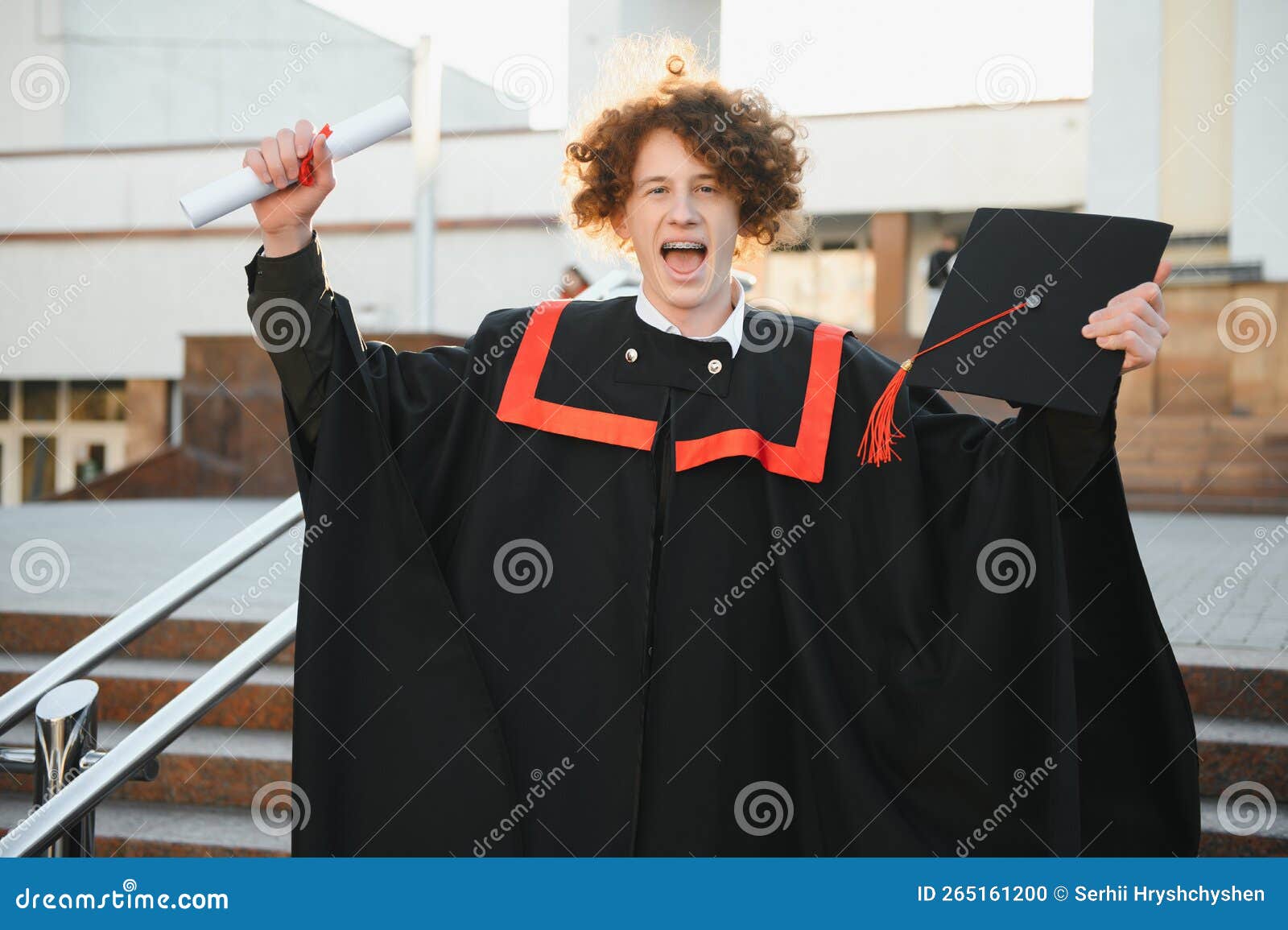 Handsome Graduate in Graduation Glow with Diploma. Stock Photo - Image ...