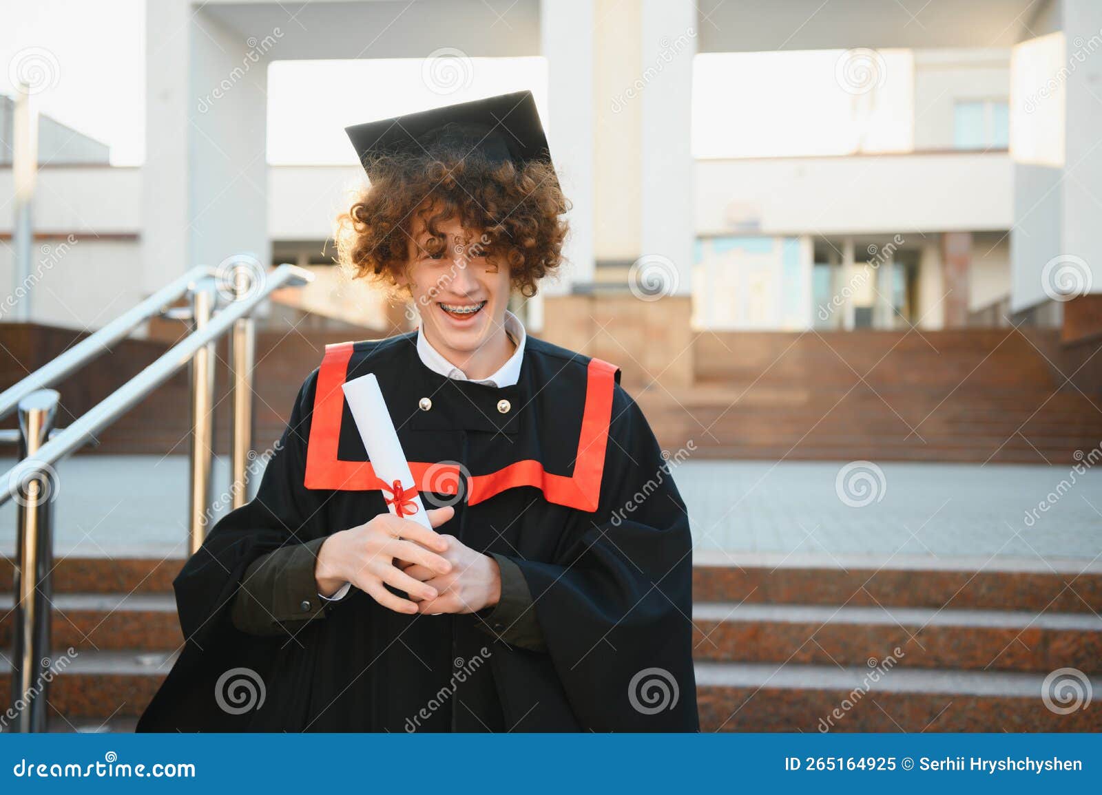 Handsome Graduate in Graduation Glow with Diploma. Stock Image - Image ...