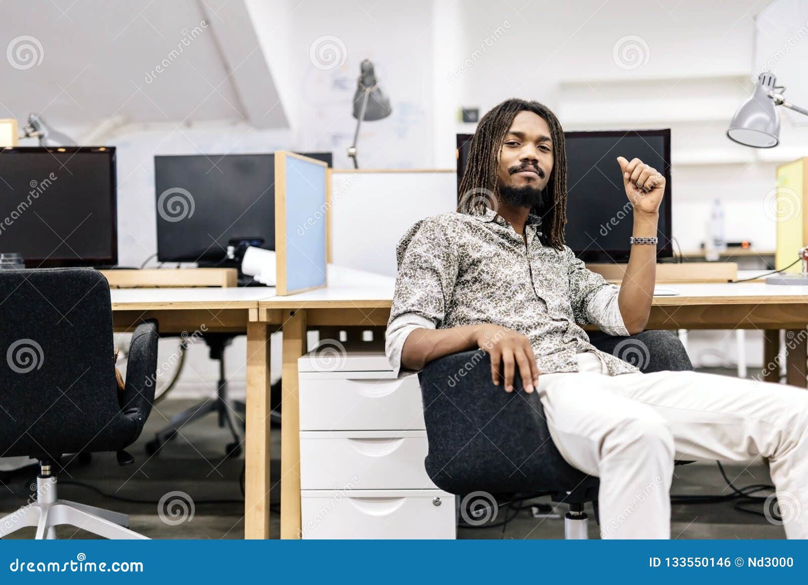 Handsome Graphics Designer Sitting at a Desk Stock Photo - Image of ...