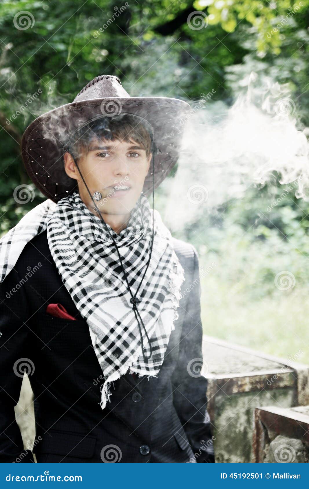 Handsome guy with a cigar stock image. Image of clothing - 45192501