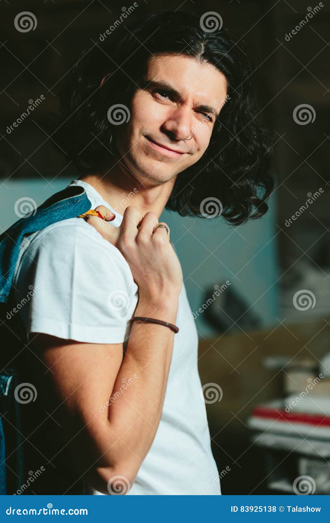 Handsome Guy with a Denim Jacket Over His Shoulder Stock Photo - Image ...