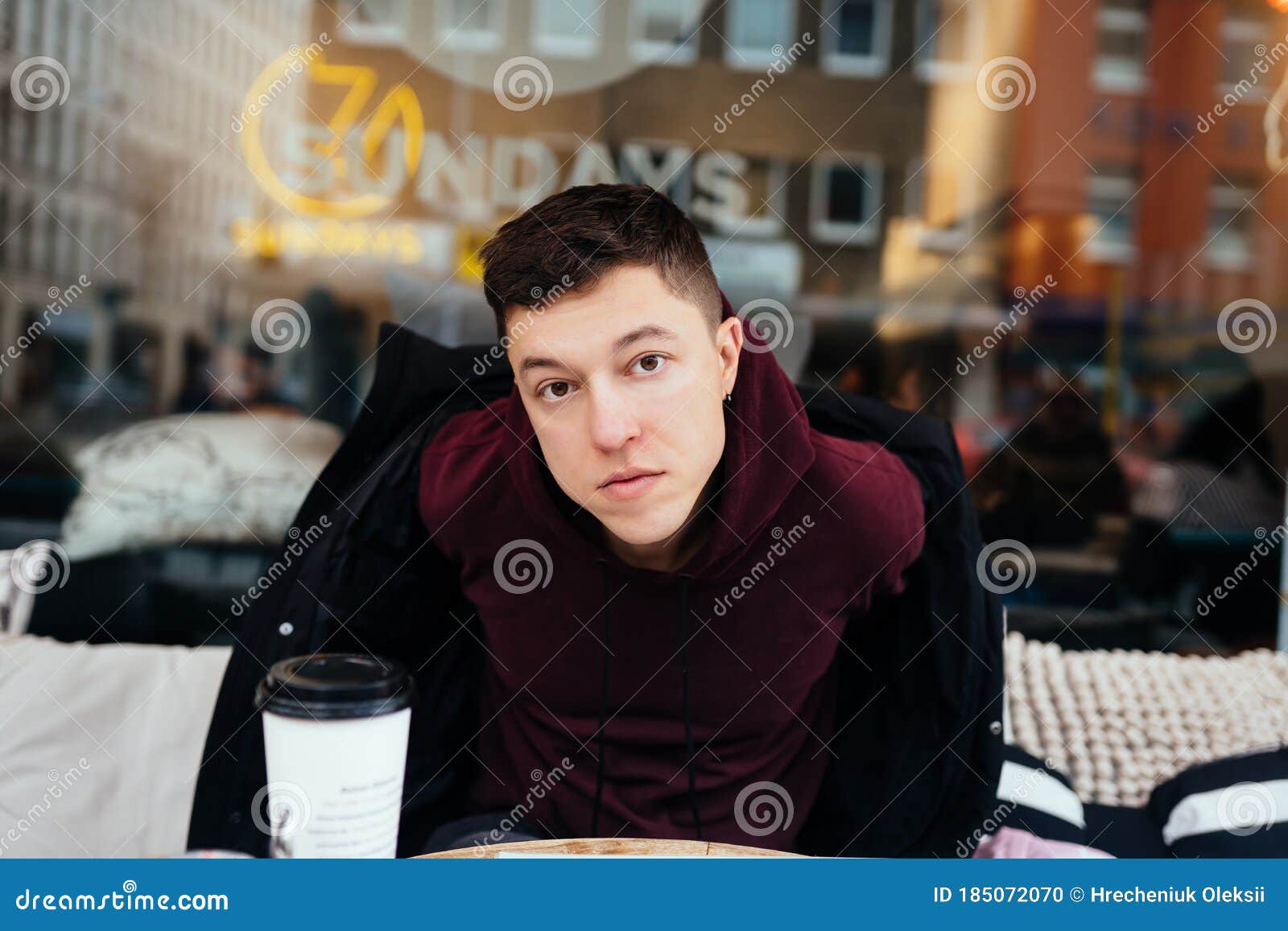 Handsome Guy Hanging Out in an Outdoor Cafe Stock Photo - Image of ...