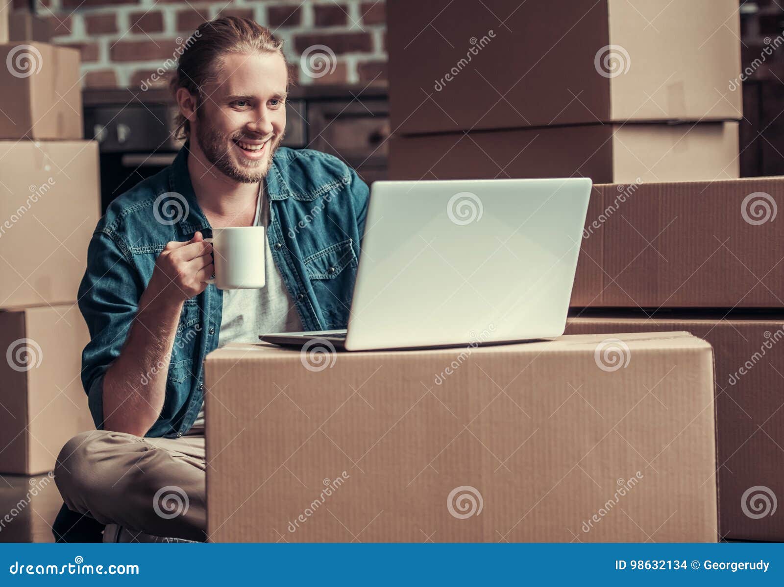Handsome guy moving stock photo. Image of handsome, gadget - 98632134
