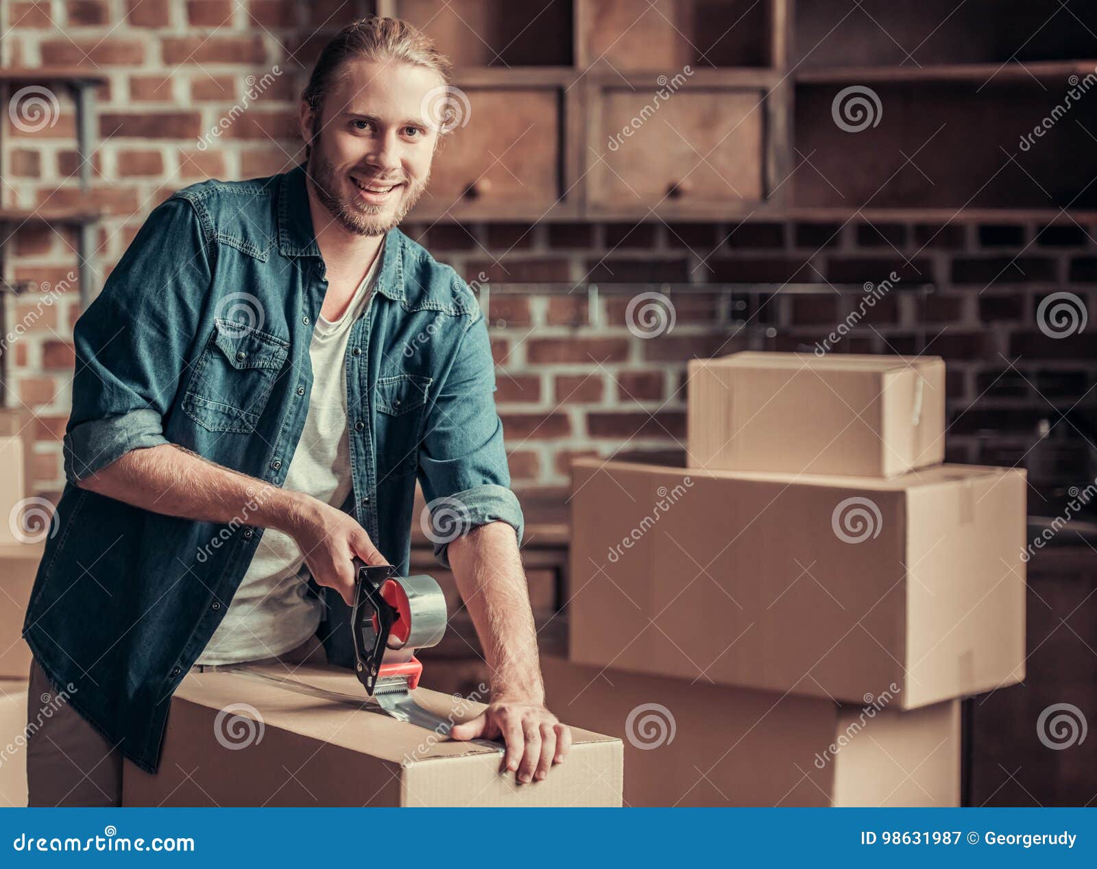 Handsome guy moving stock image. Image of life, property - 98631987