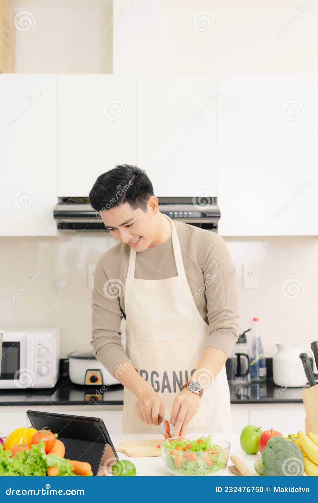 Handsome Guy Nice Smile is Cooking Salad Stock Photo - Image of counter ...