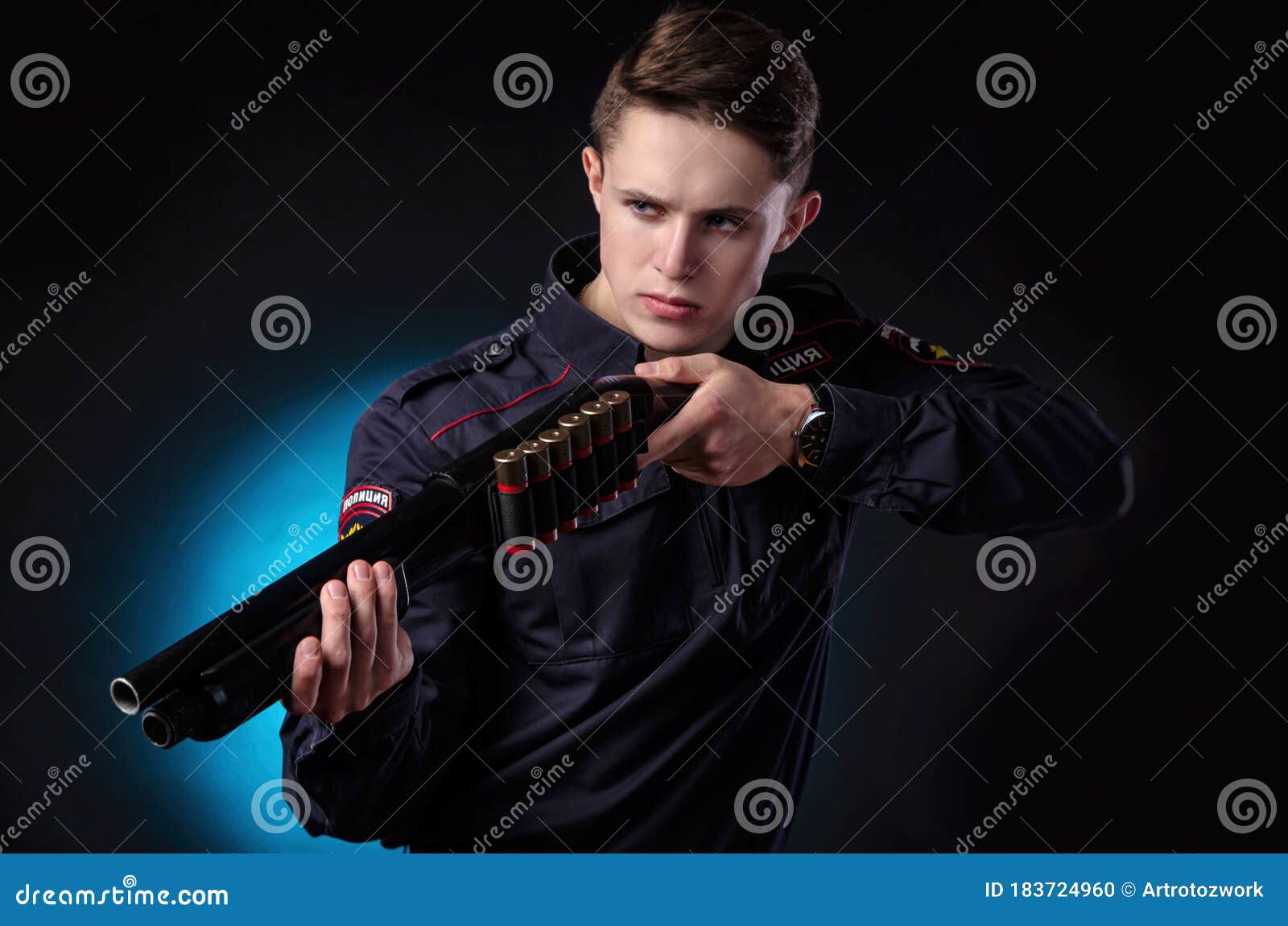 Handsome Guy in a Police Officer`s Uniform with a Gun Stock Photo ...