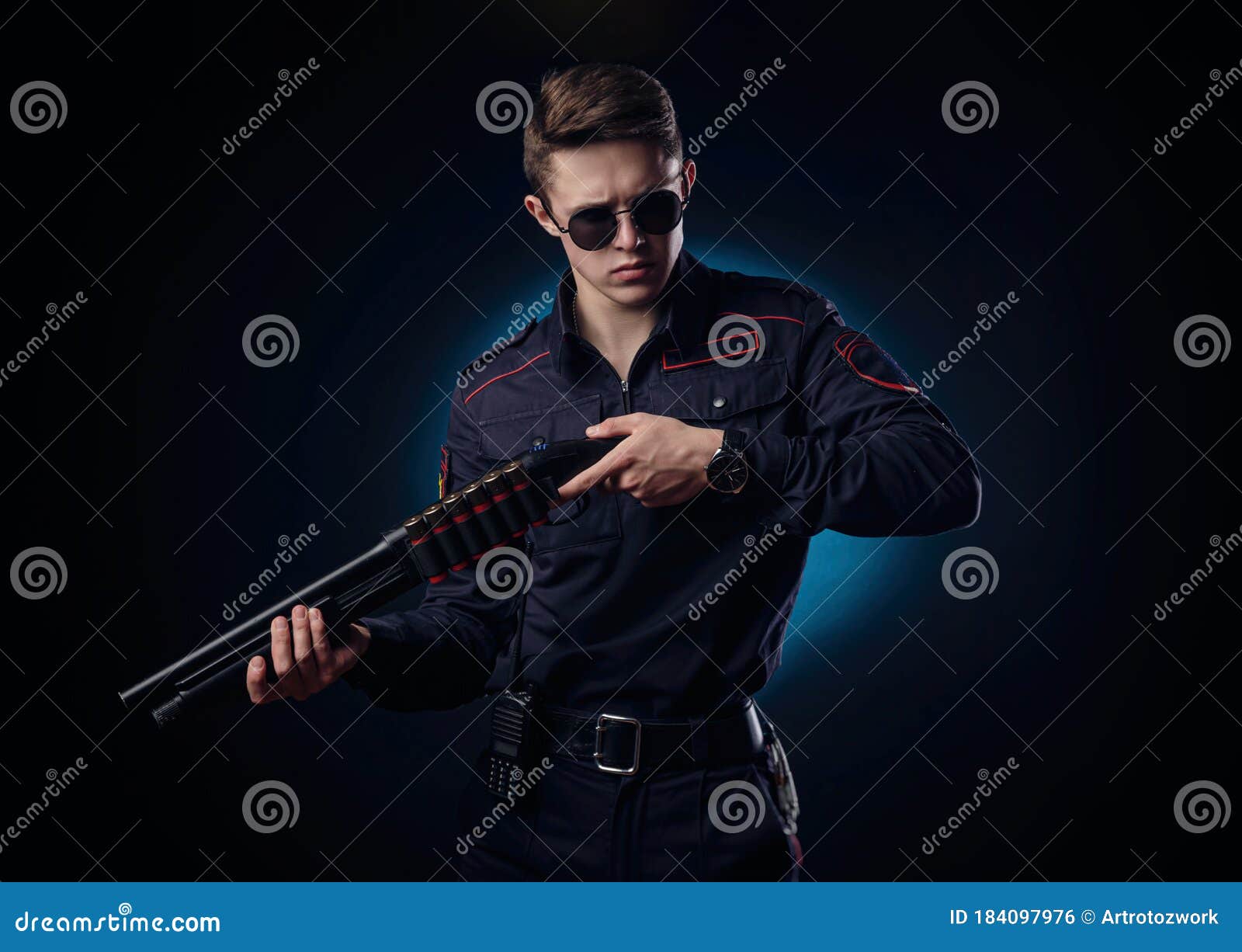 Handsome Guy in a Police Officer`s Uniform with a Gun Stock Photo ...