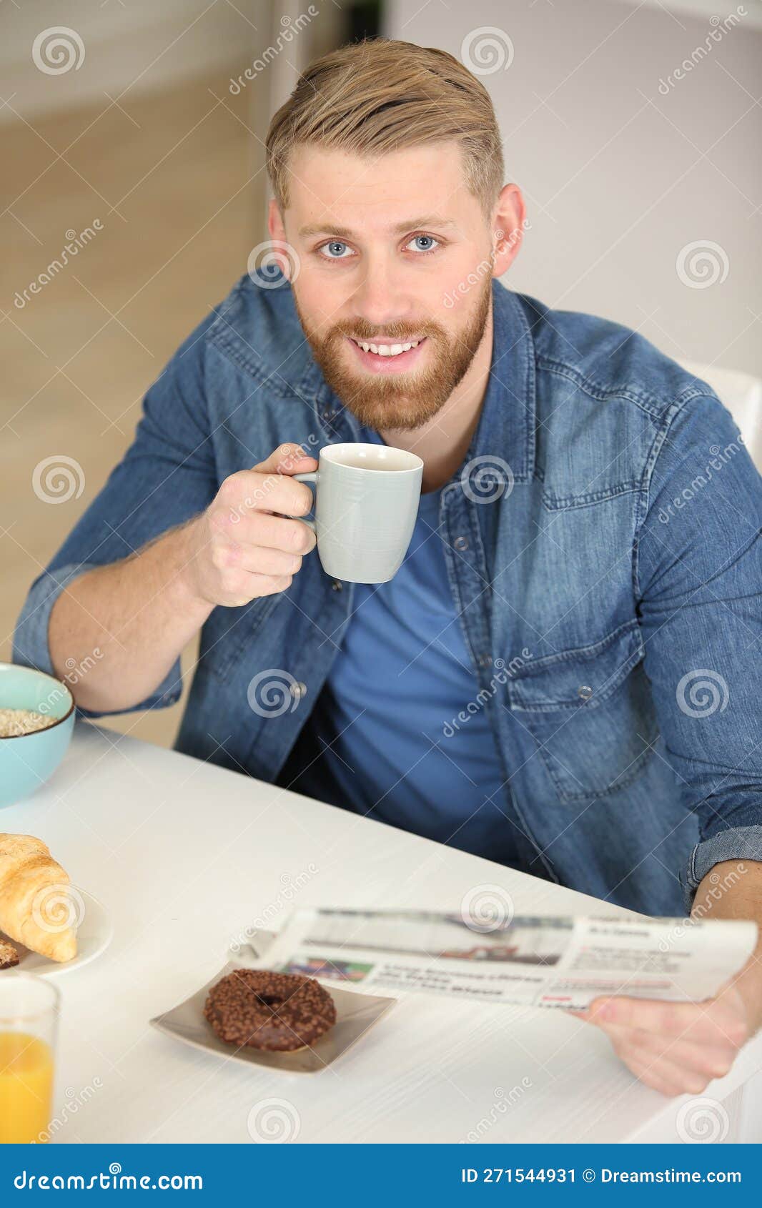 Handsome Guy Reading Newspaper and Holding Coffee Cup Stock Image ...