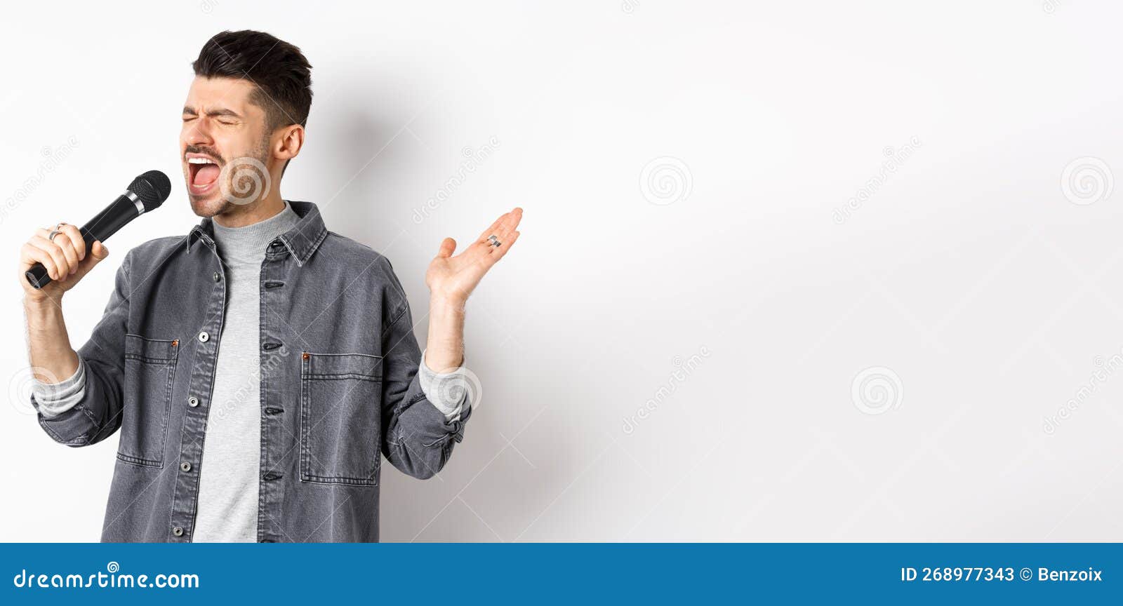 Handsome Guy Singing in Mic with Passion, Perform for Audience, Holding ...