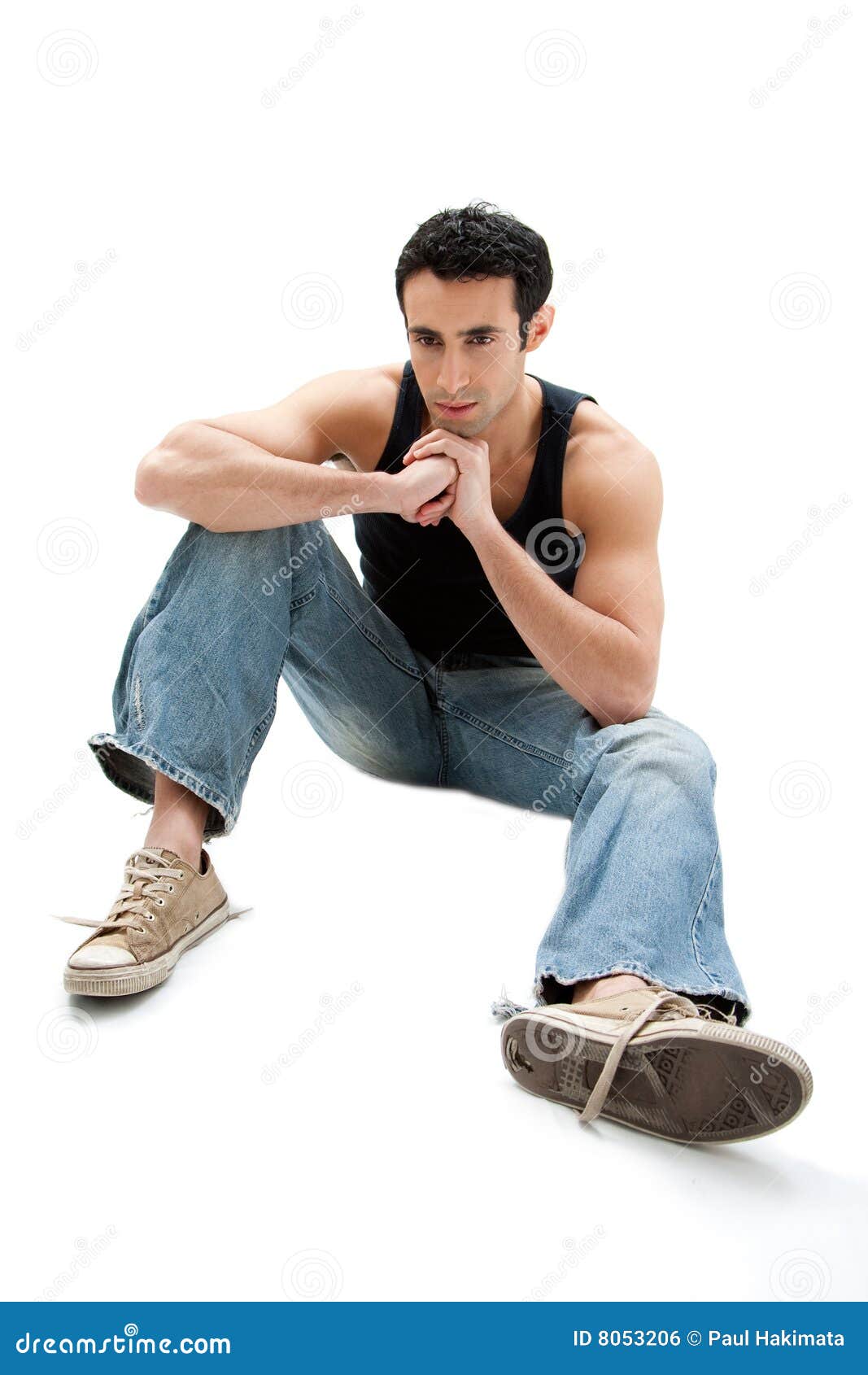 Handsome Guy Sitting on Floor Stock Photo - Image of jean, pondering ...