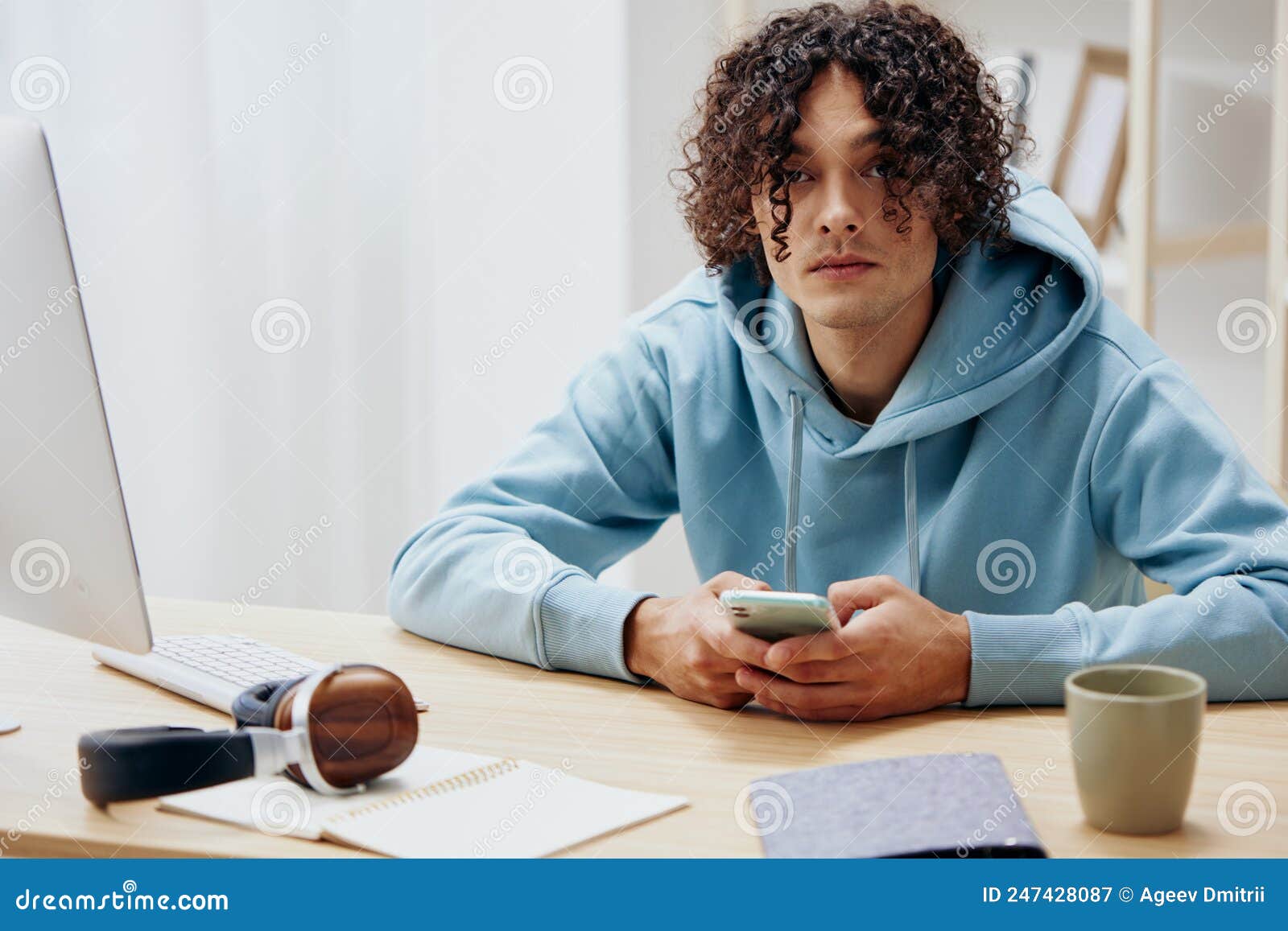 Handsome Guy Sitting in Front of the Computer Work at Home Interior ...