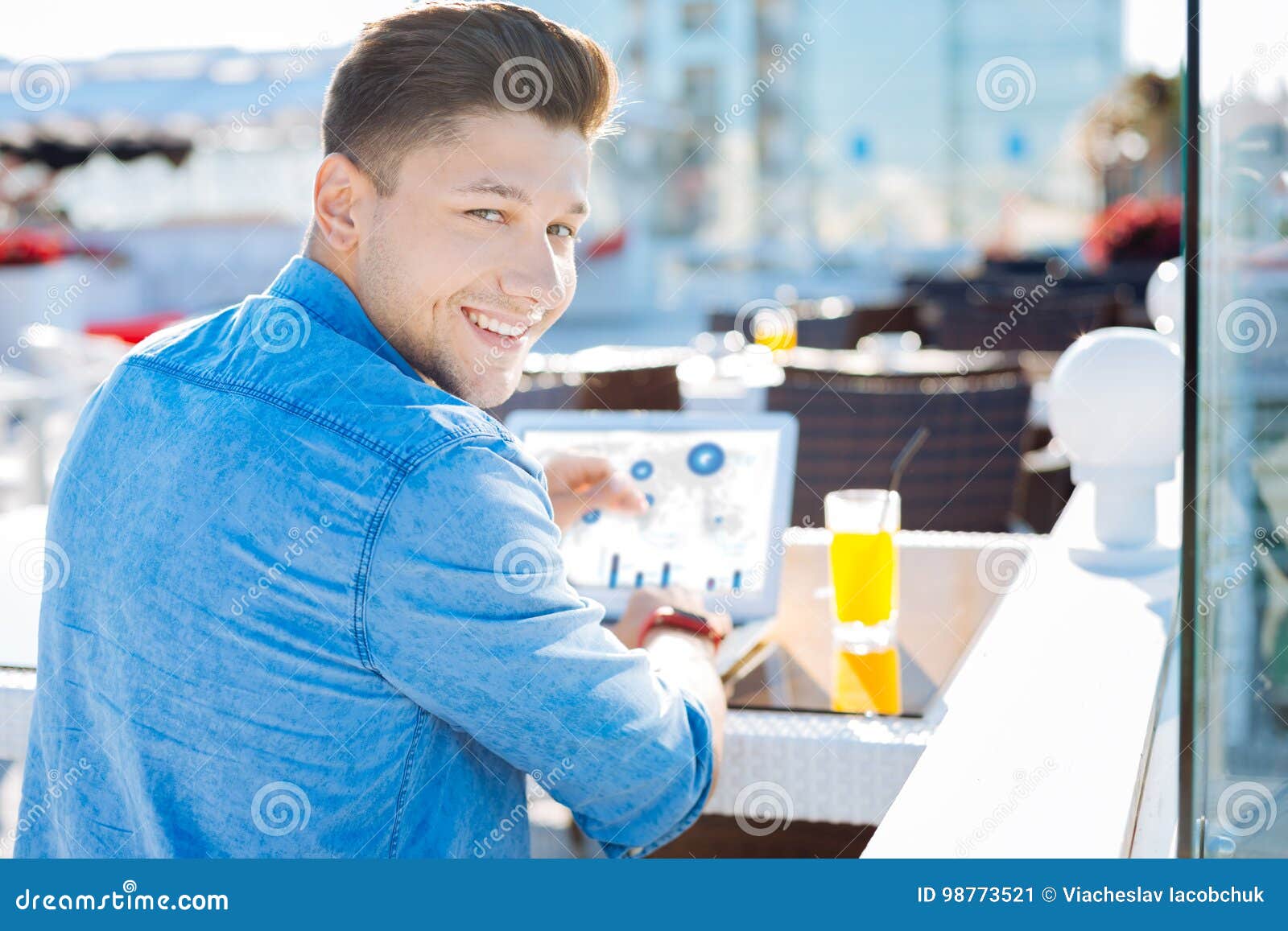 Handsome Guy Smiling for Camera while Working Outdoors Stock Image ...
