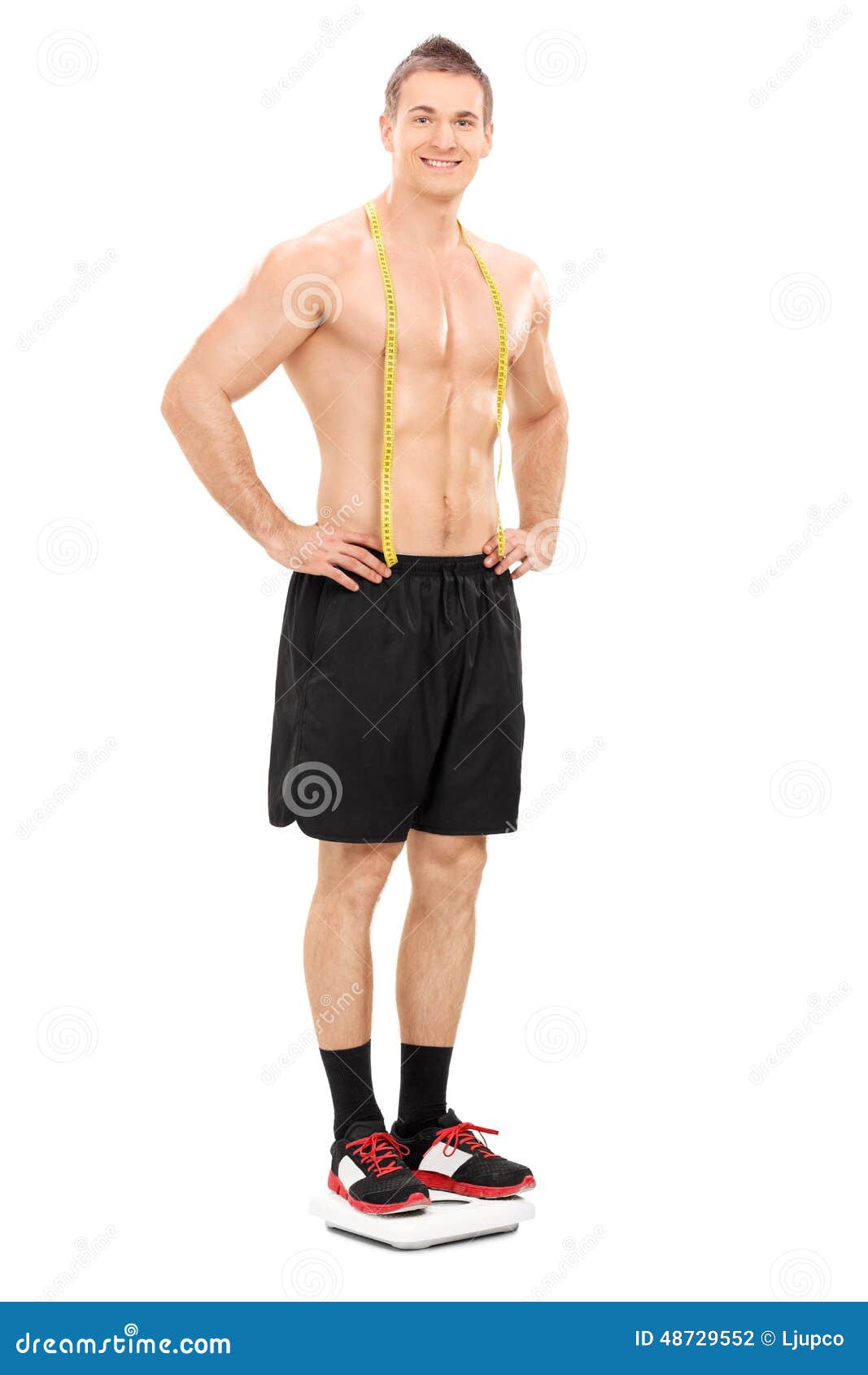 Handsome Guy Standing on a Weight Scale Stock Photo - Image of length ...