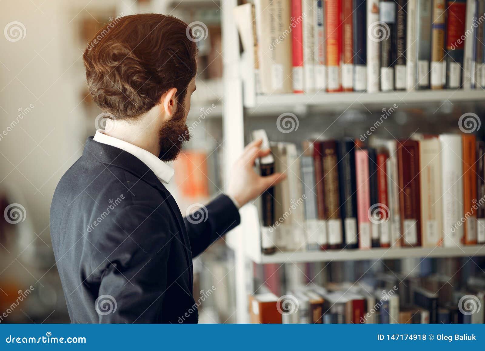 Handsome Guy Study at the Library Stock Photo - Image of bookshelf ...