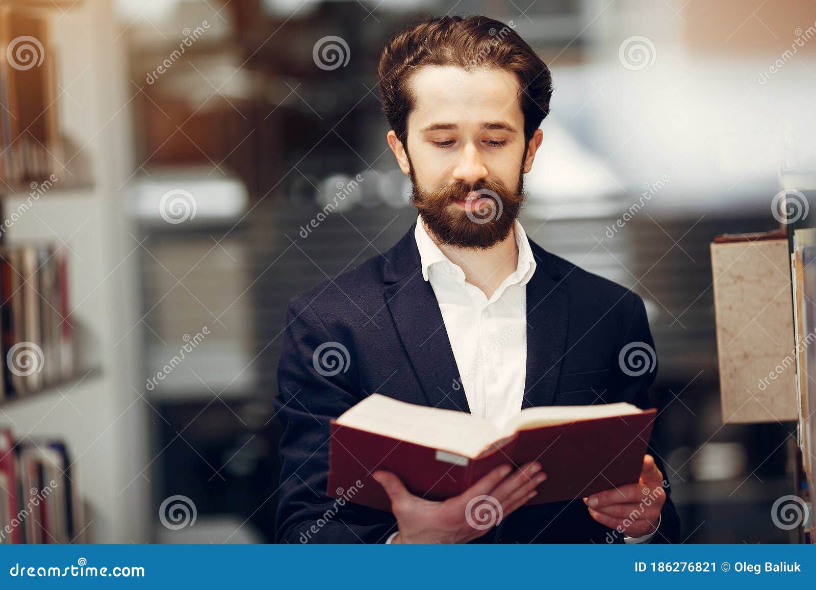 Handsome Guy Study at the Library Stock Image - Image of bookshelf ...