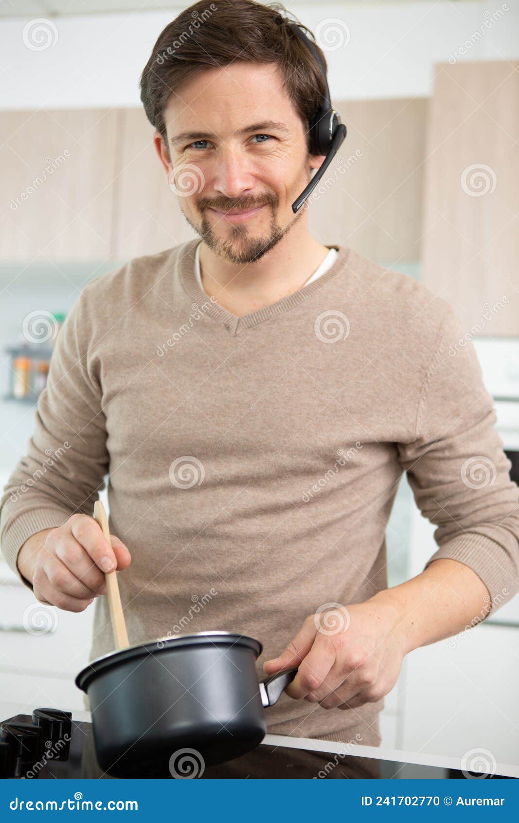 Handsome Guy Talking on Mobile Phone while Cooking Stock Photo - Image ...