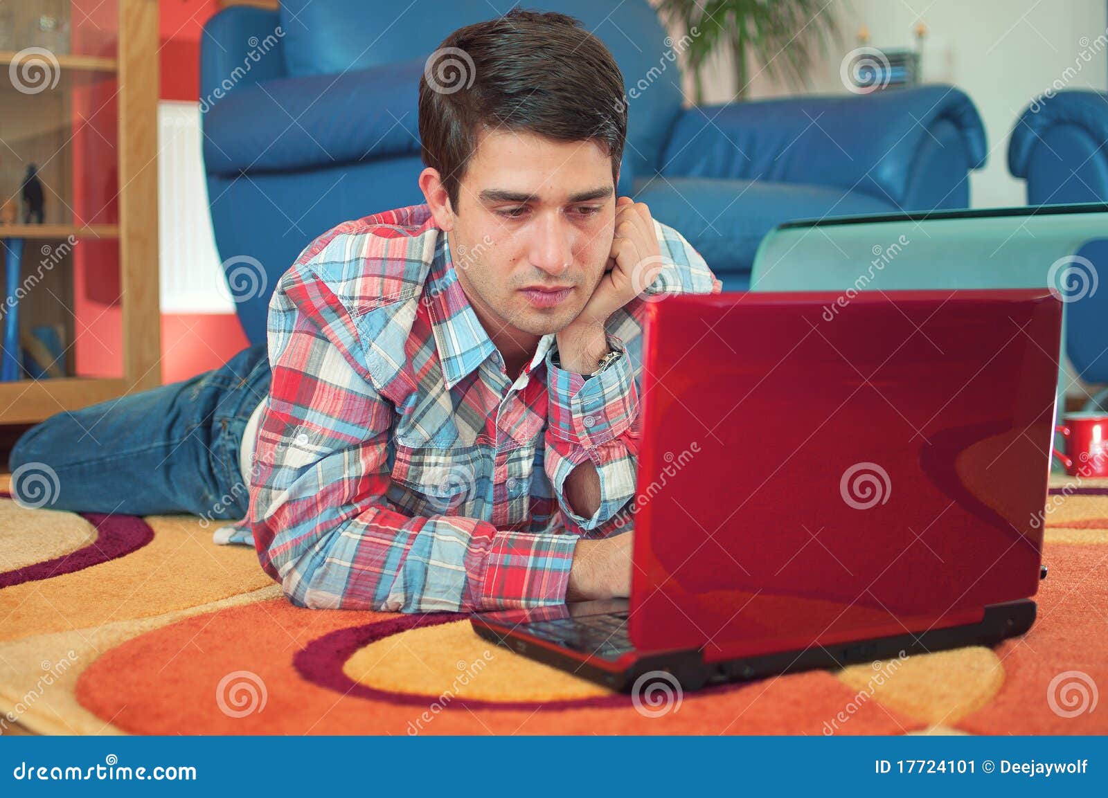 Handsome Guy Using Laptop while Lying on a Floor Stock Image - Image of ...