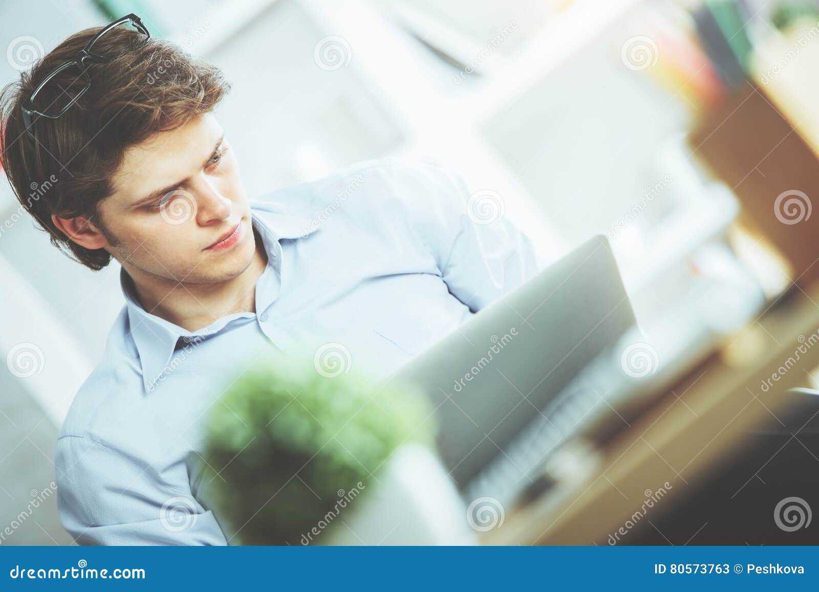 Handsome guy using laptop stock image. Image of decorative - 80573763