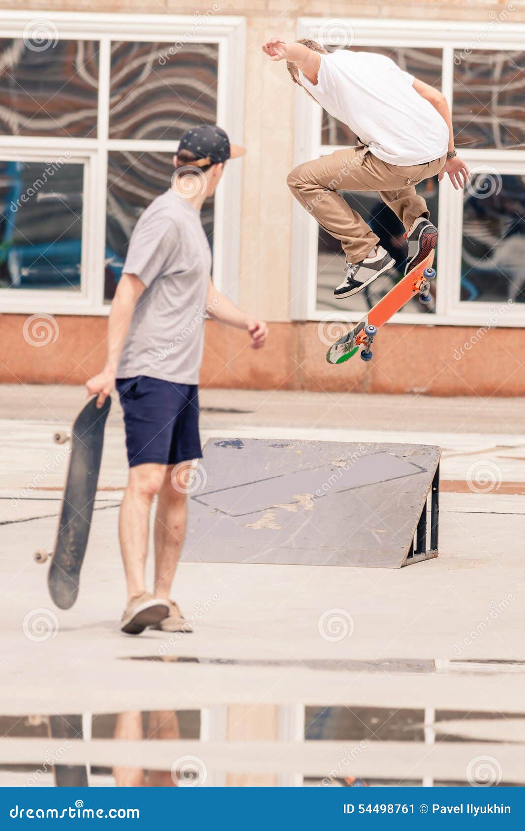 Handsome Guys Riding and Doing Trick by Skateboard Stock Image - Image ...