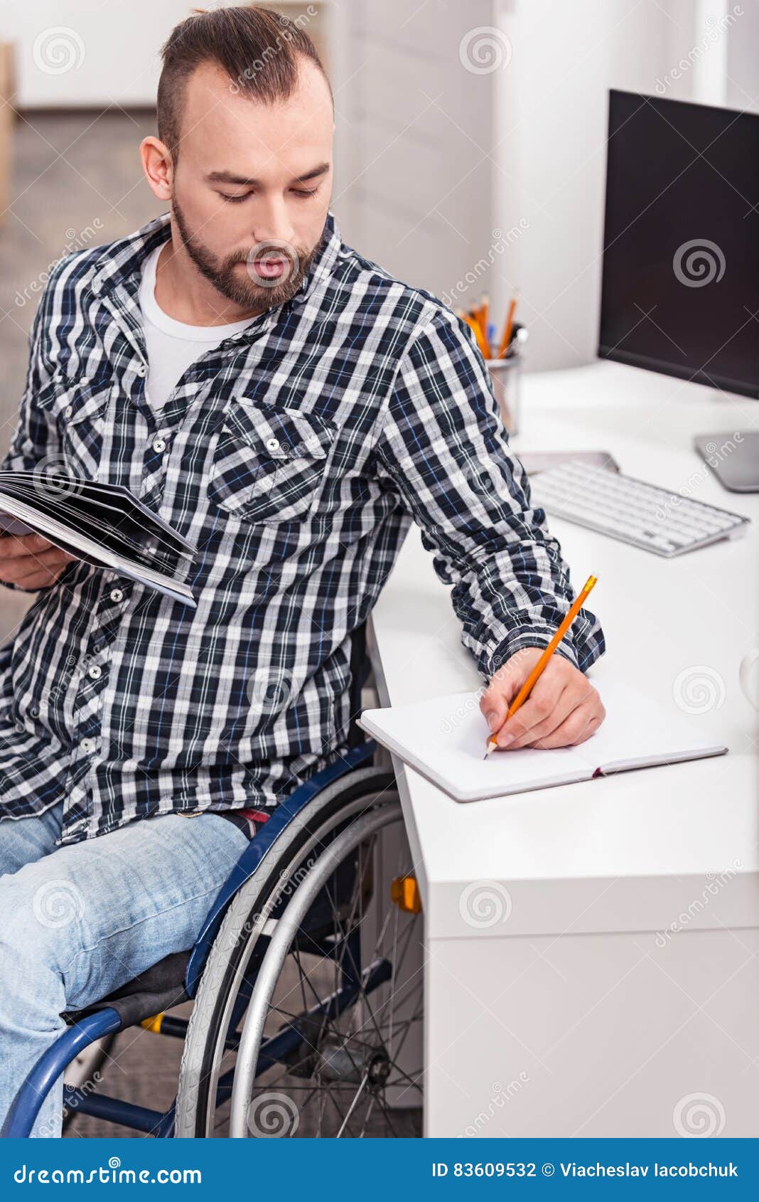 Handsome Handicapped Man Taking Notes Stock Photo - Image of relax ...