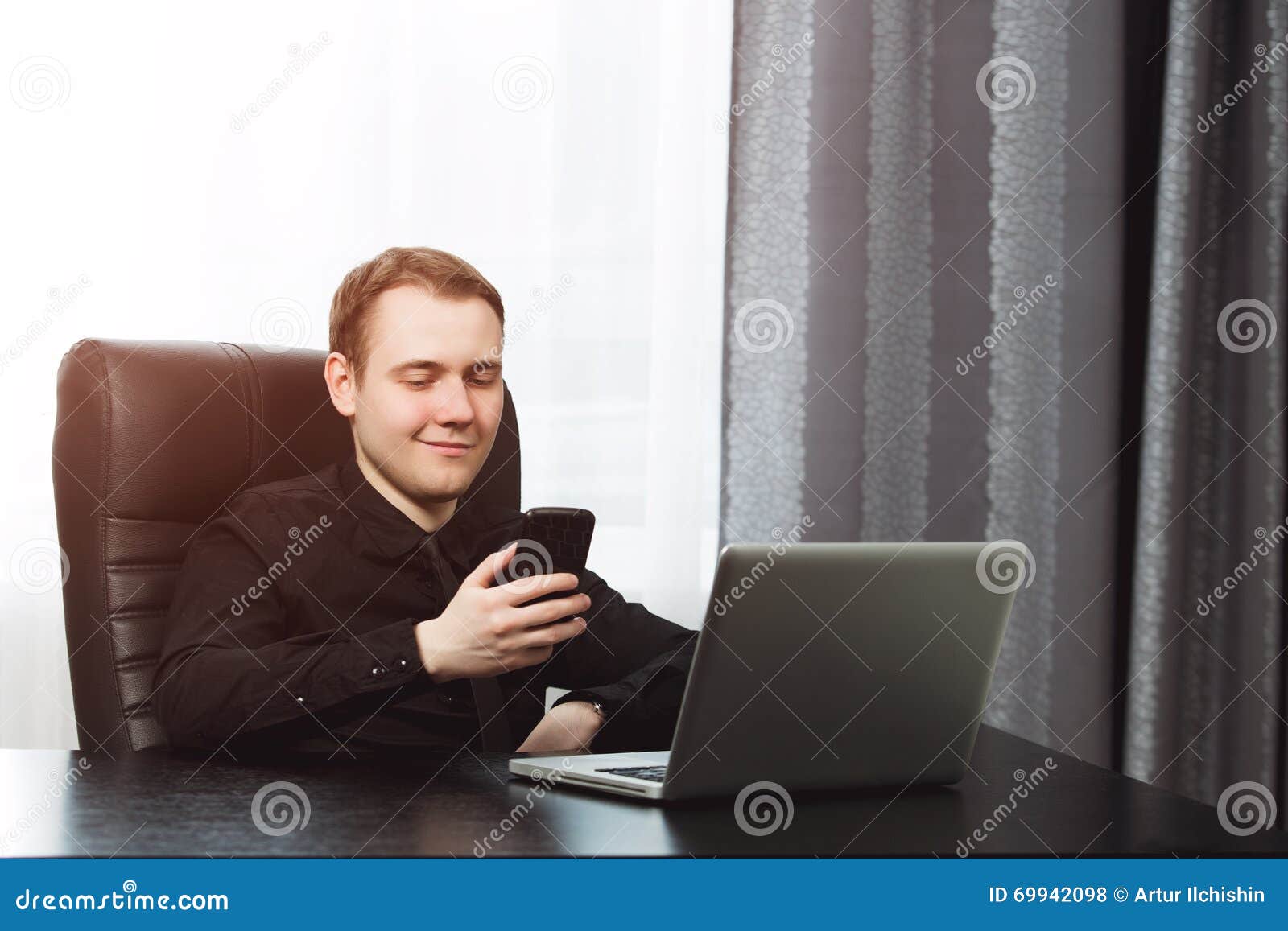 Handsome Happy Business Man Texting at His Workplace Stock Photo ... Handsome Happy Business Man Texting at His Workplace Stock Photo ...