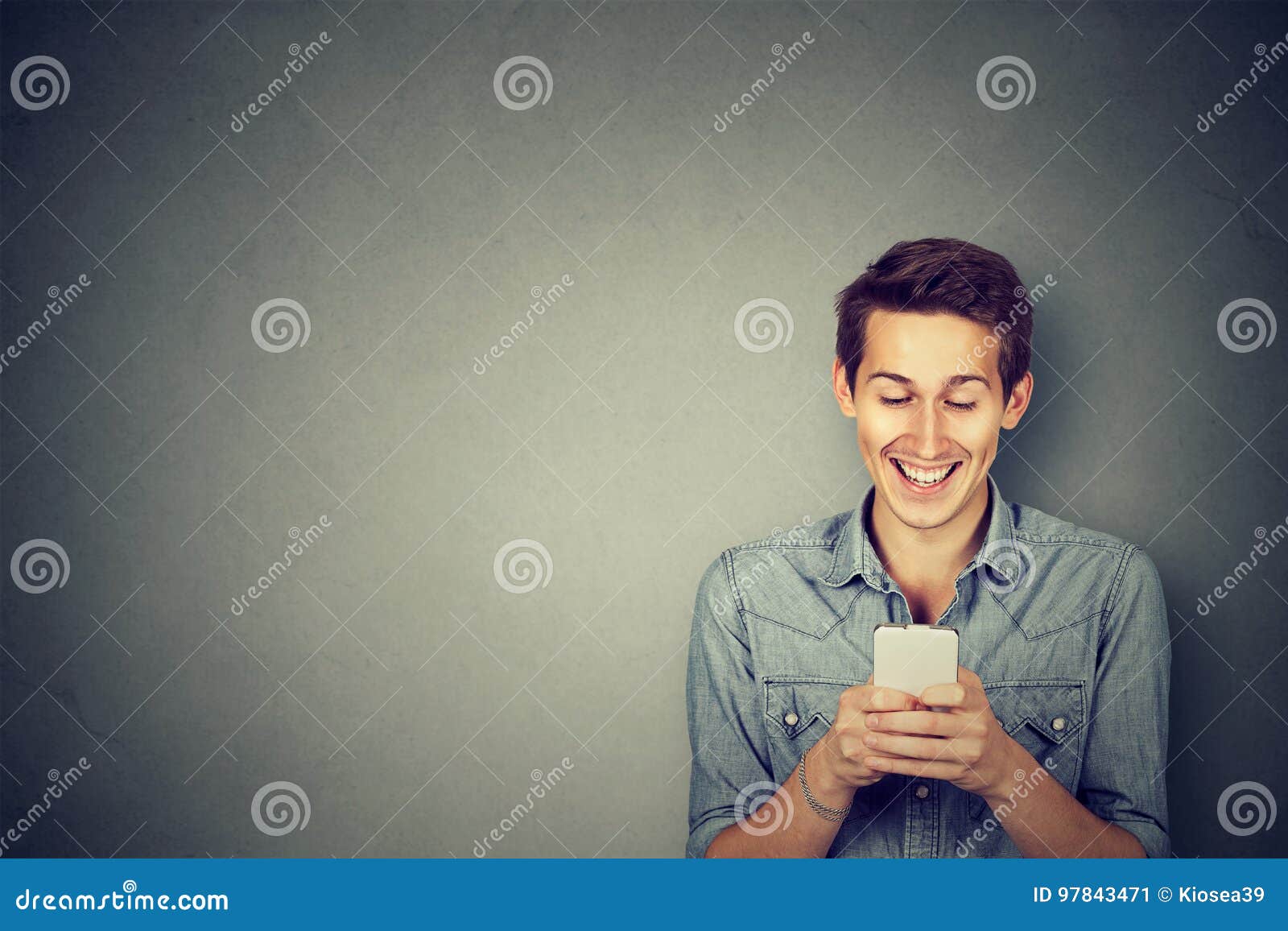 Handsome Happy Guy Using a Smartphone Stock Image - Image of ...