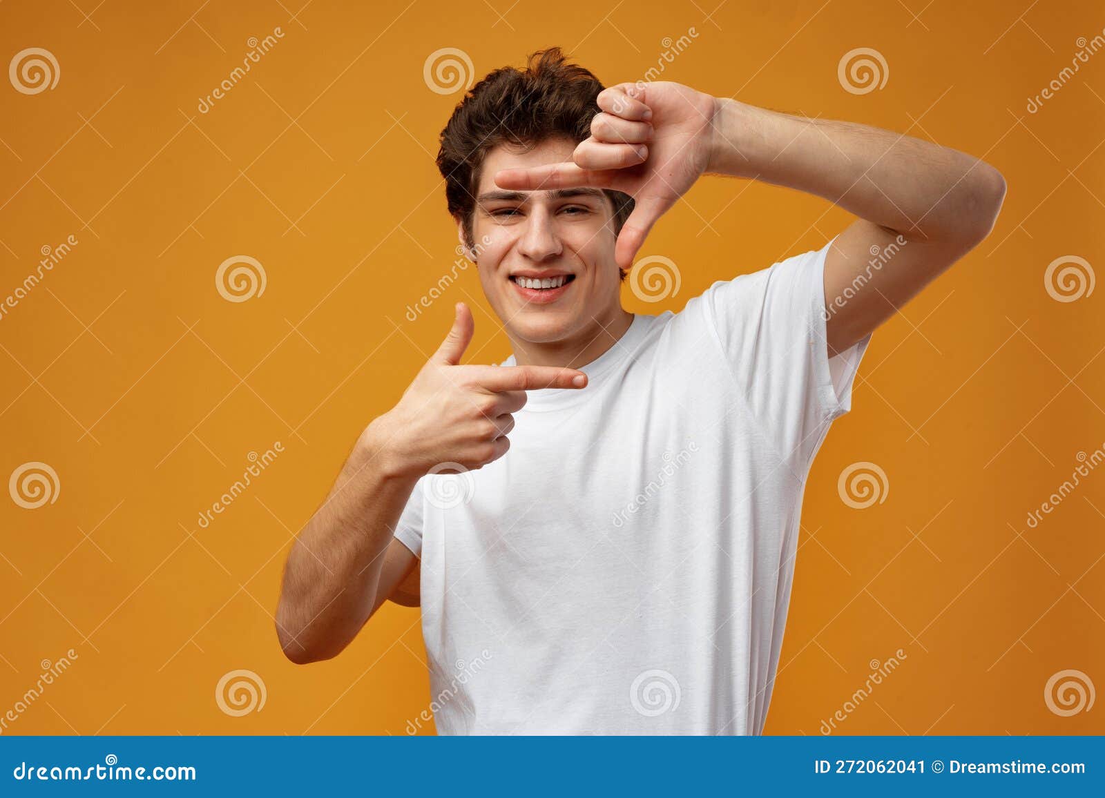 Handsome Happy Male Looking through a Frame Formed by His Hands Stock ...