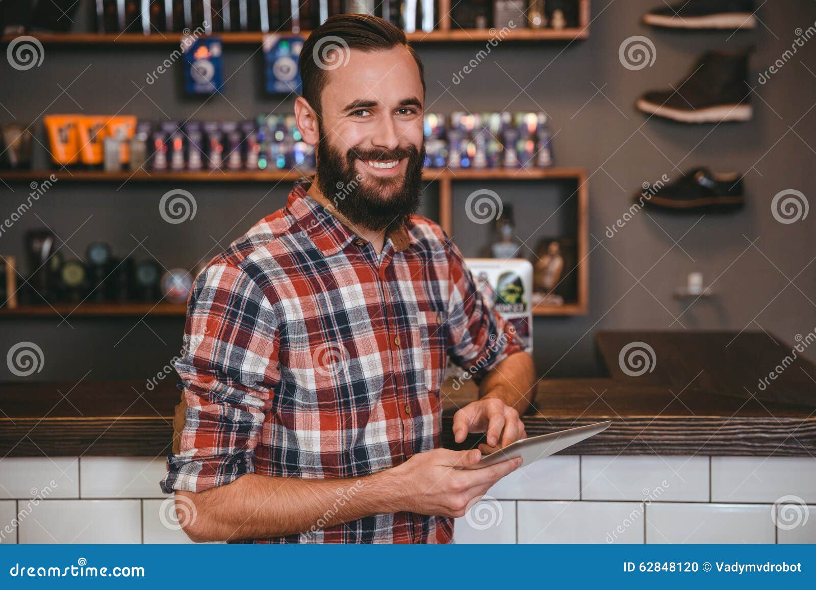 Handsome Happy Man with Beard Using Tablet in Barbershop Stock Photo ...