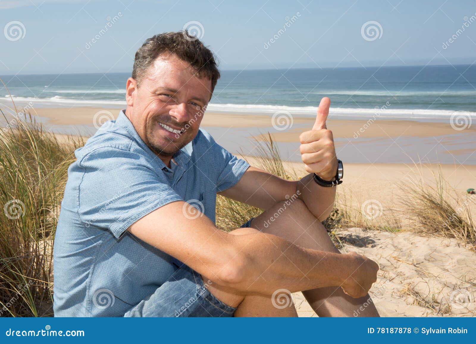 Handsome Happy Man Giving Thumbs Up on the Beach Stock Photo - Image of ...