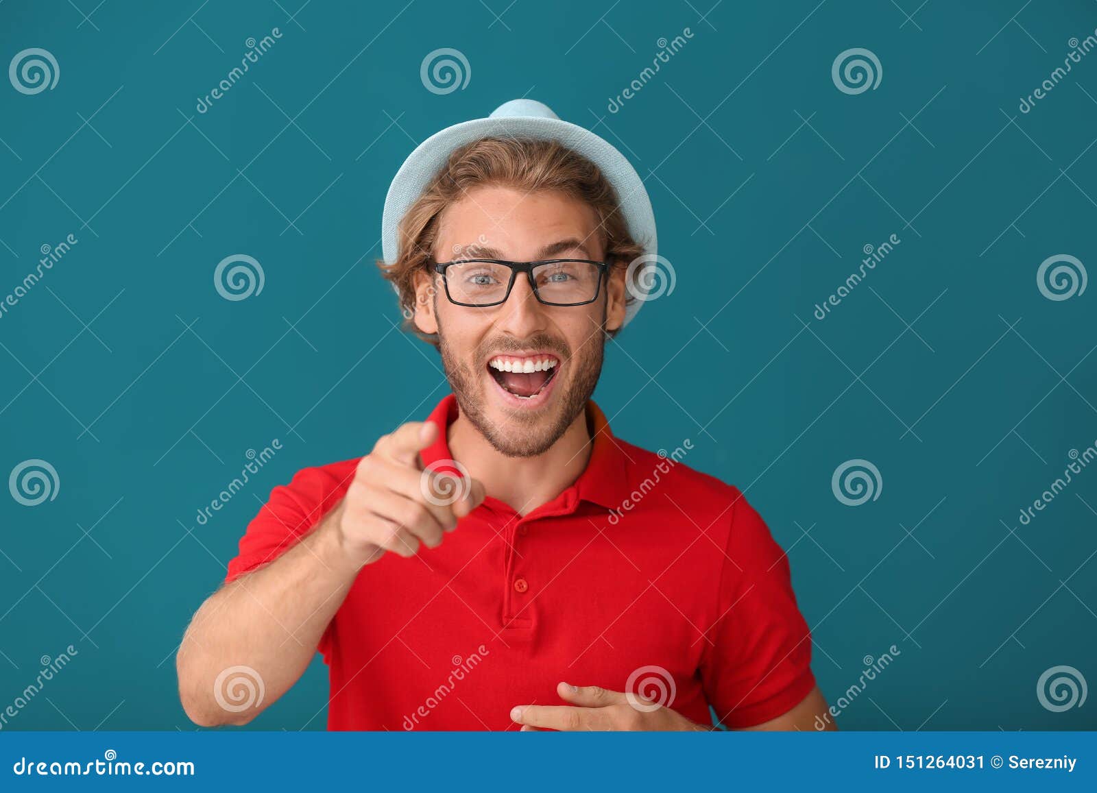 Handsome Happy Man Pointing At Viewer On Color Background Stock Image