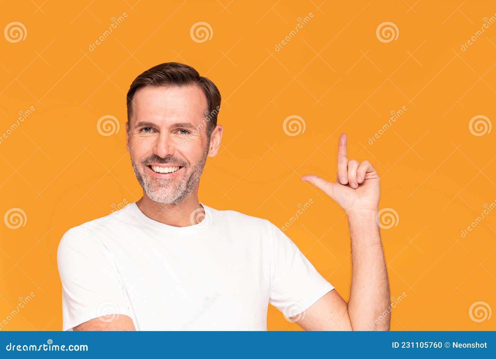 Handsome Happy Man Smiling And Looking At The Camera Pointing With His