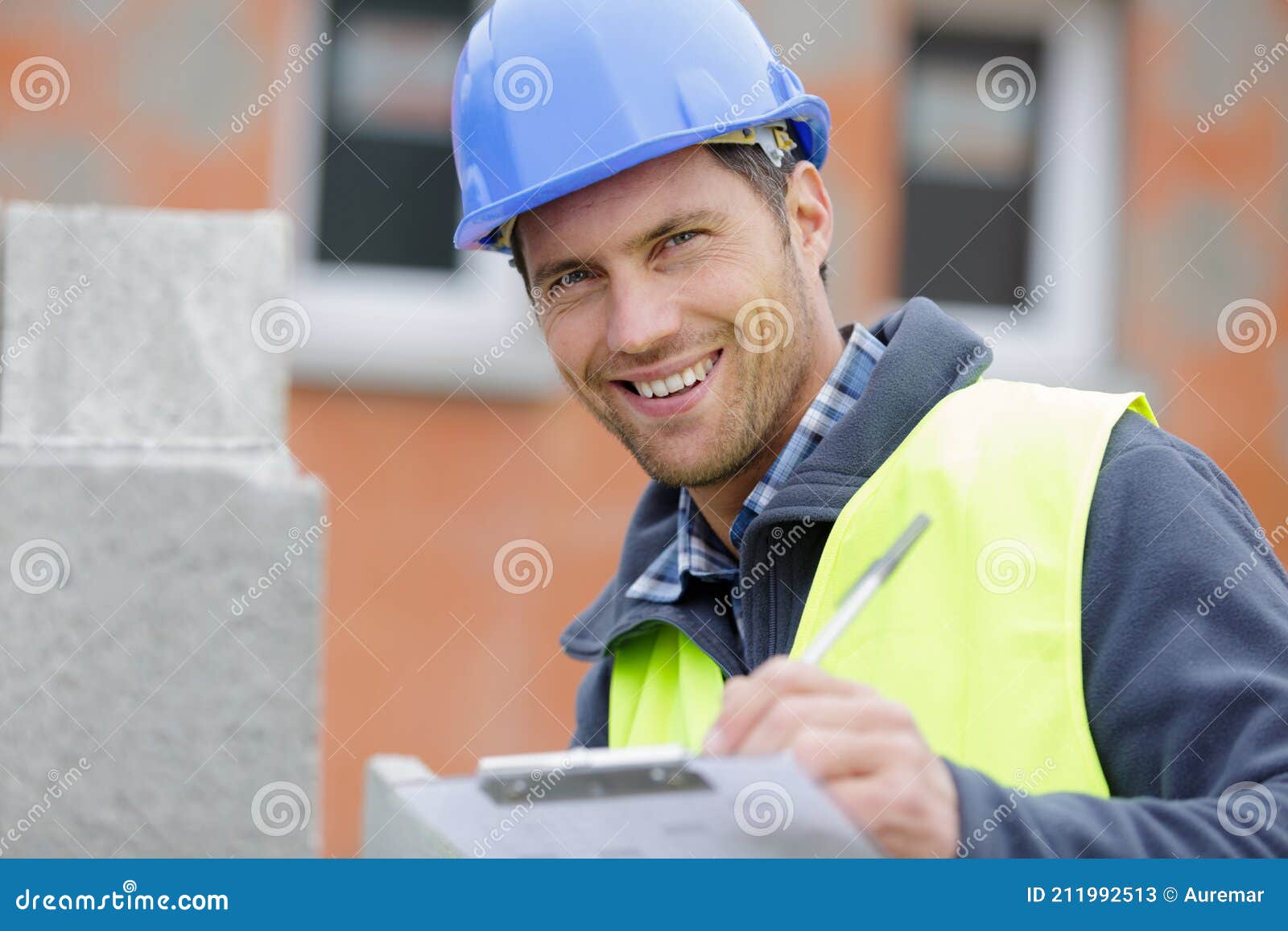 Handsome Happy Workman Writing on Clipboard Stock Image - Image of ...