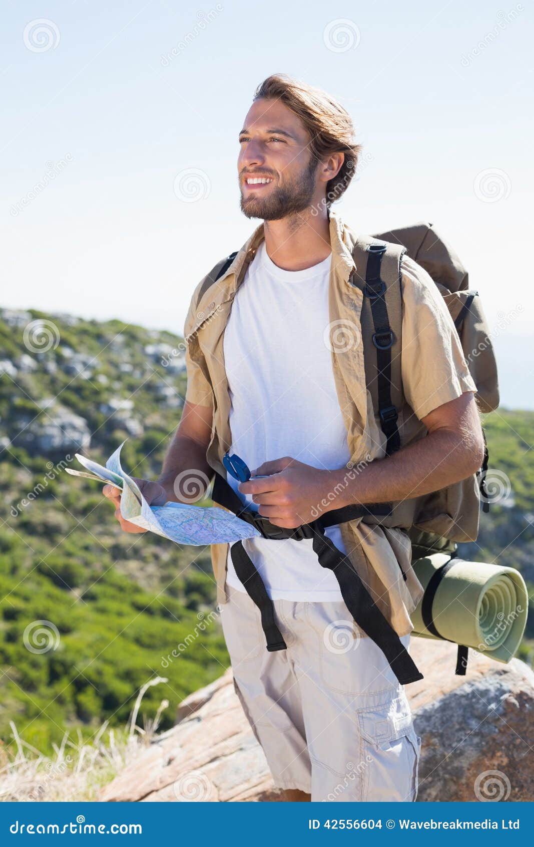 Handsome Hiker Holding Map and Compass at Mountain Summit Stock Photo ...