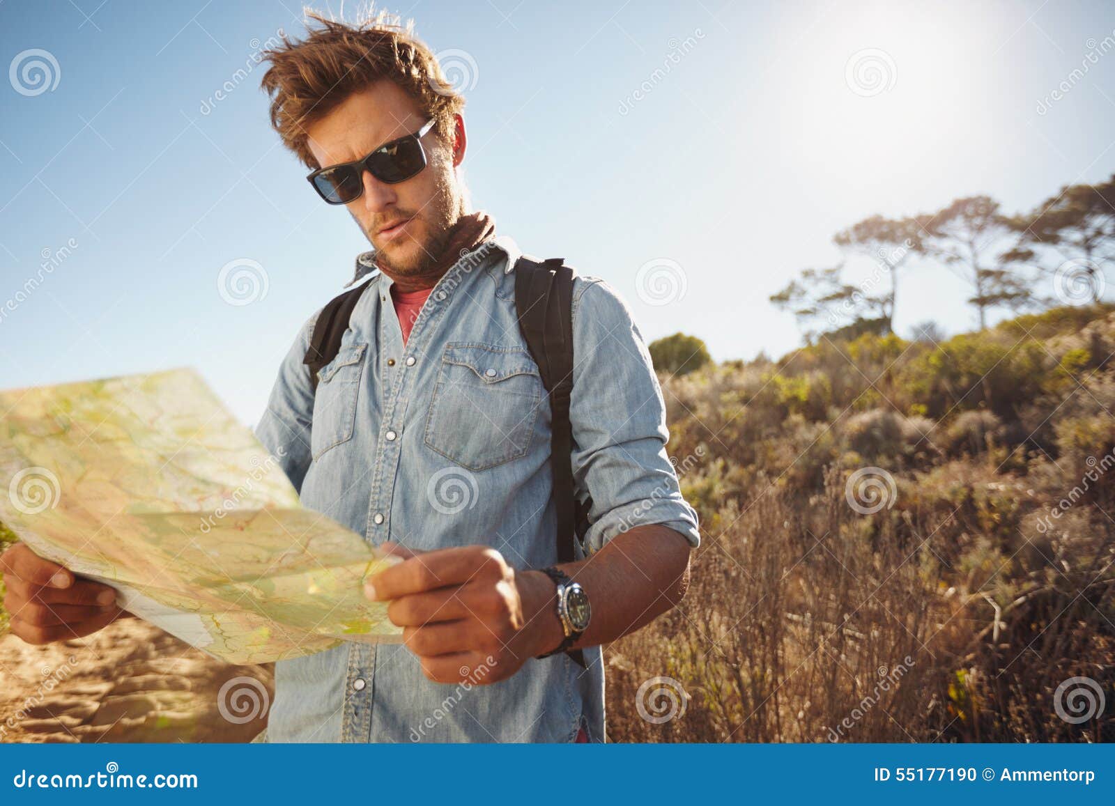 Handsome hiker using a map stock photo. Image of equipment - 55177190